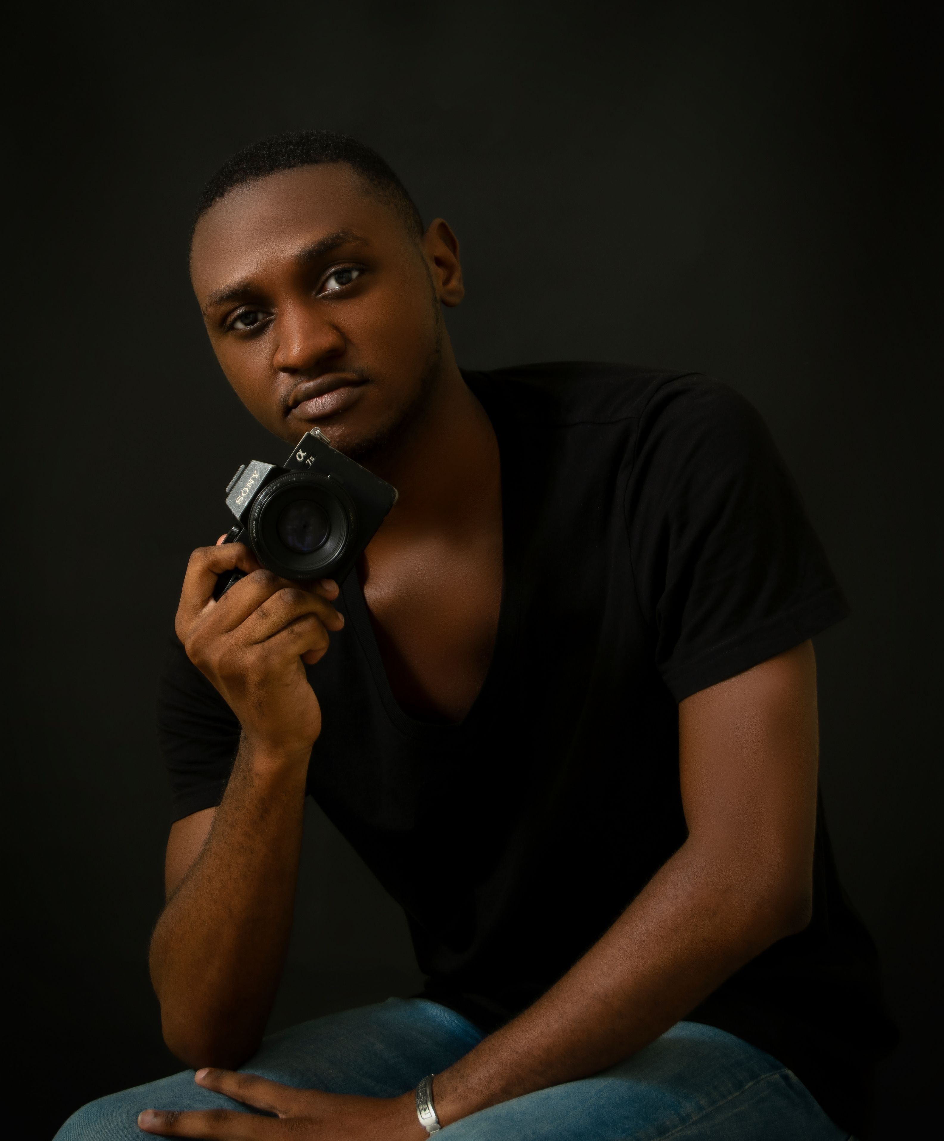 Good looking male photographer with cameras on gray background · Free ...