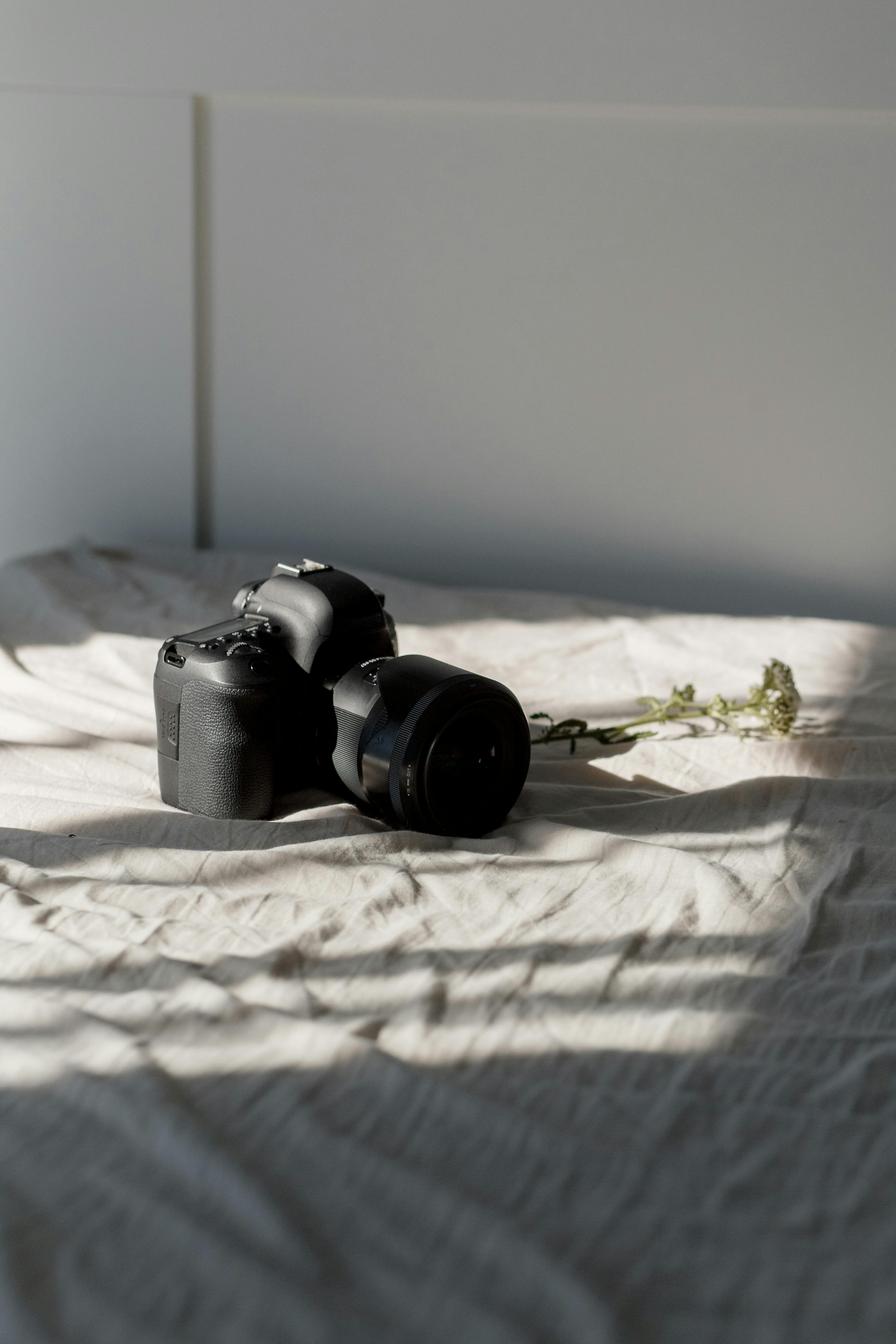 Camera on Bed in Sunlight · Free Stock Photo