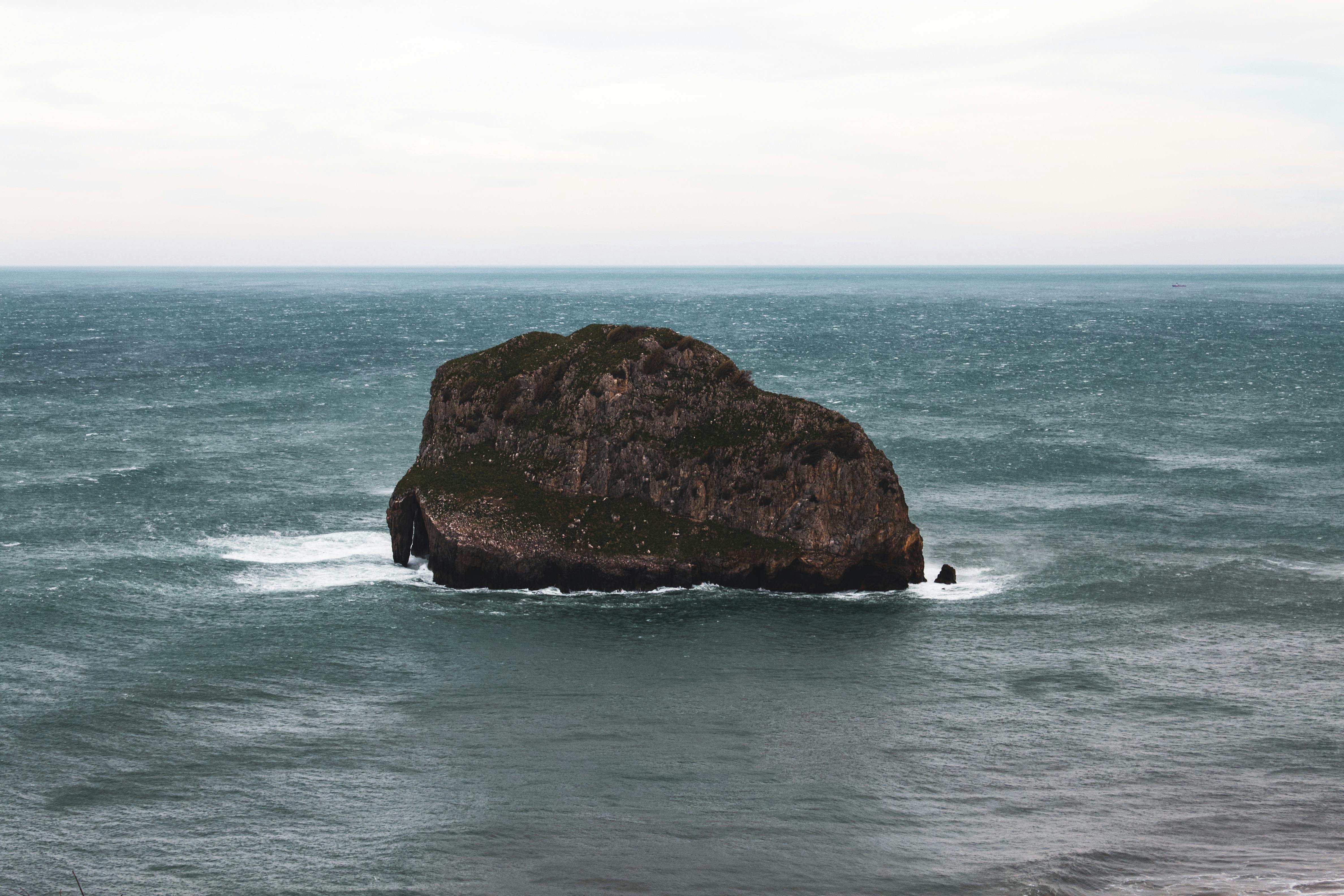A Huge Natural Rock Formation in the Middle of the Sea · Free Stock Photo