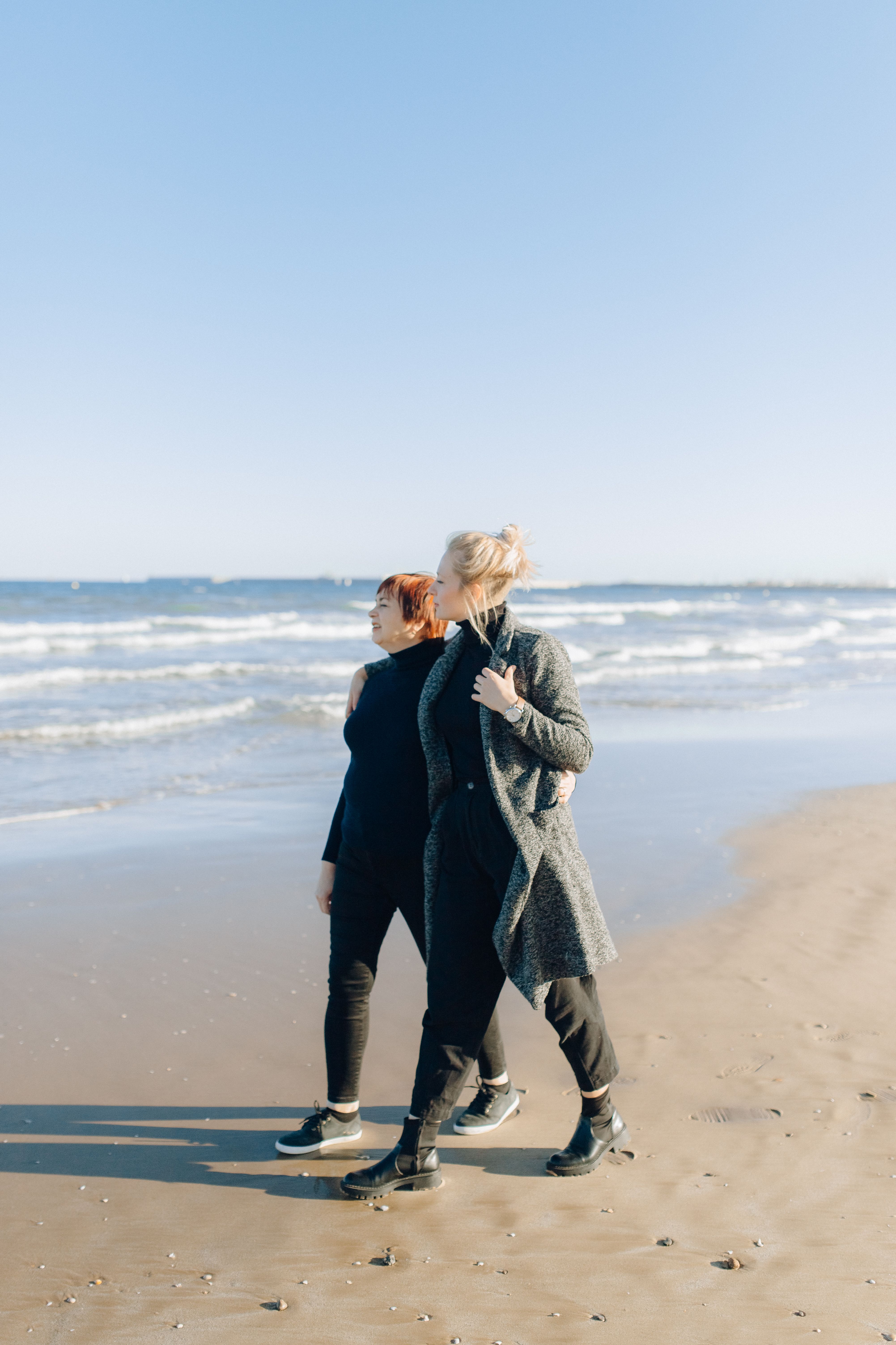 Aerial Photography of Person Standing on Seashore · Free Stock Photo