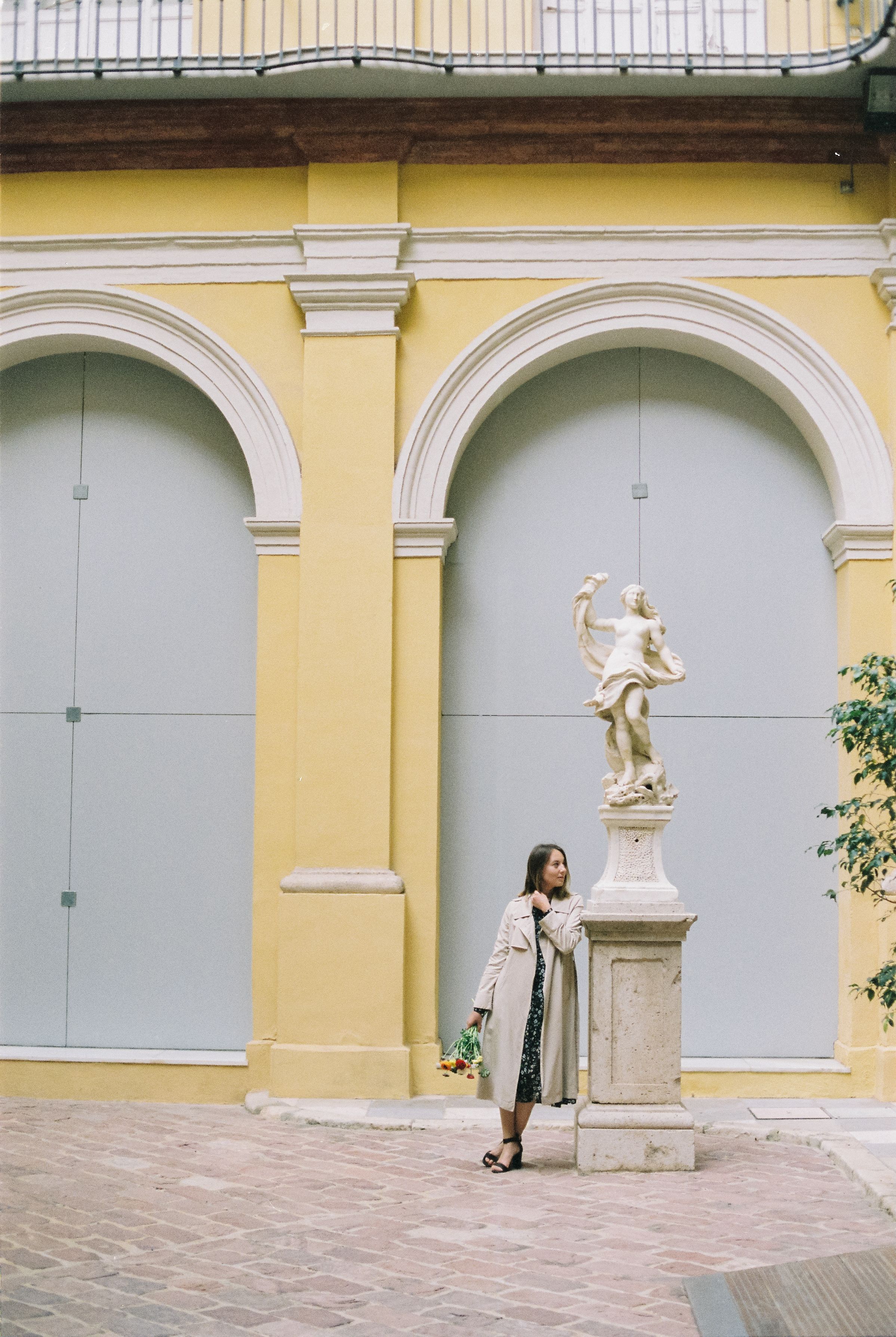 A Statue Leaning on a Wall · Free Stock Photo