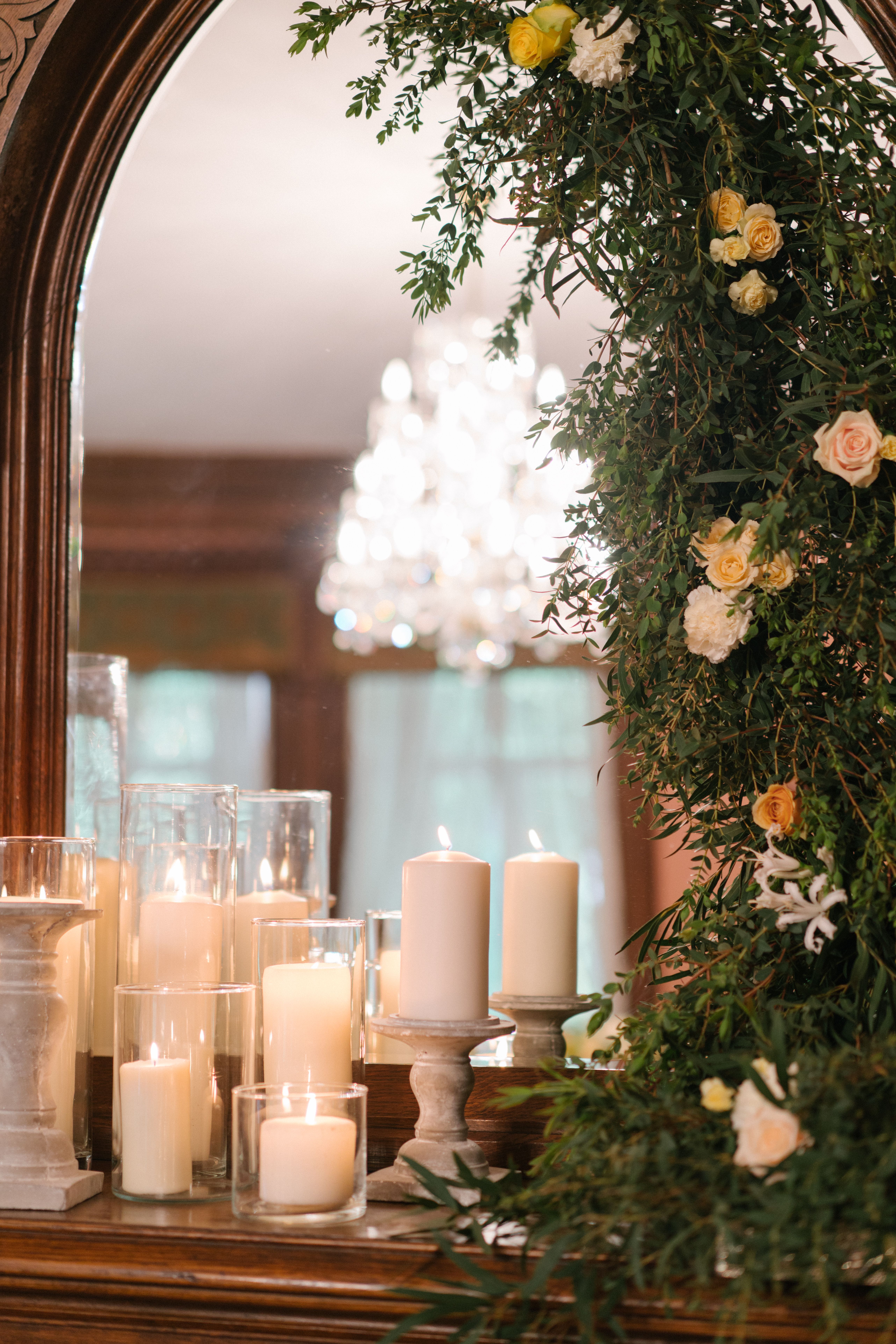 A Candle and Glass Vase Reflection on a Standing Mirror · Free Stock Photo