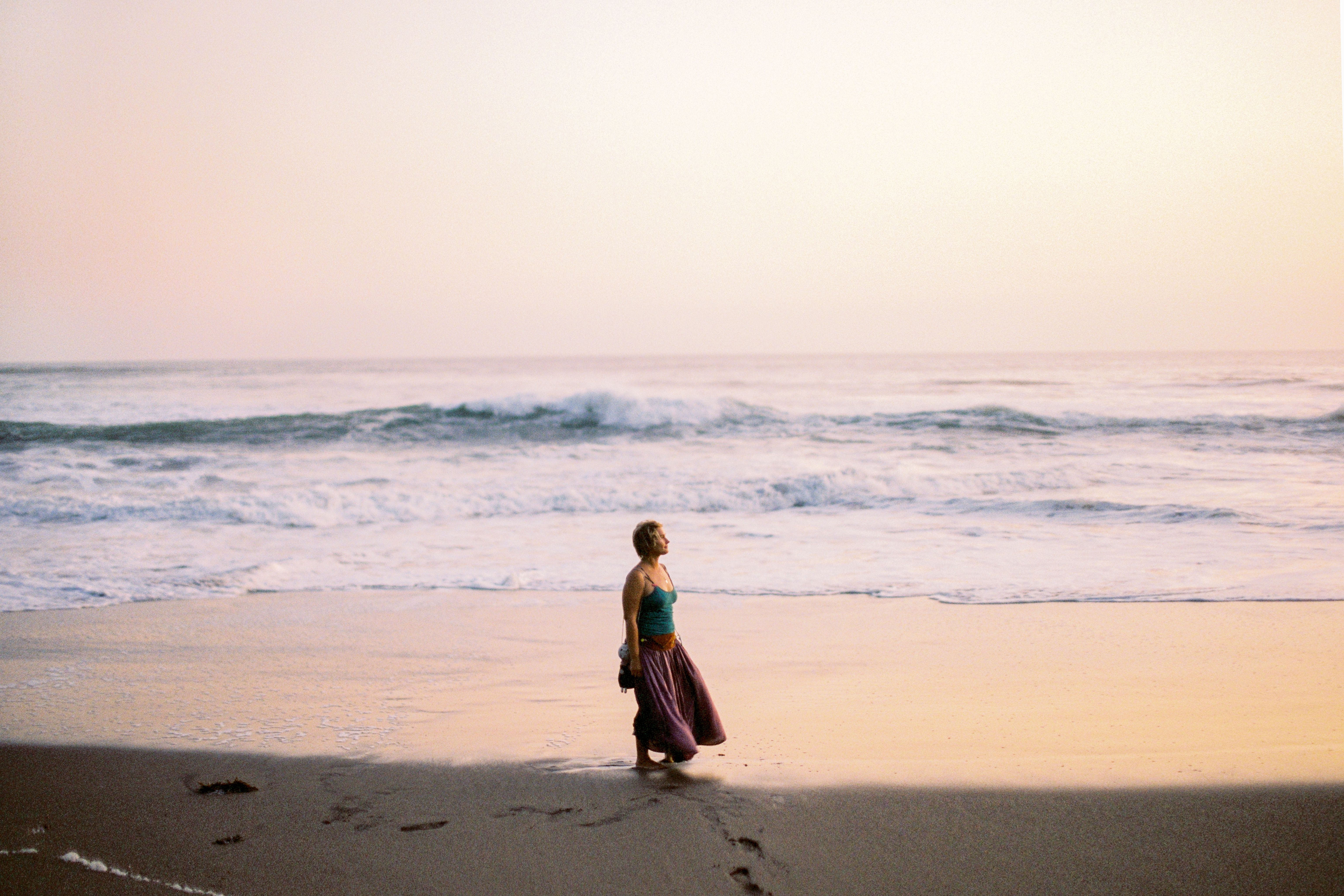 A Person Walking on the Seashore · Free Stock Photo