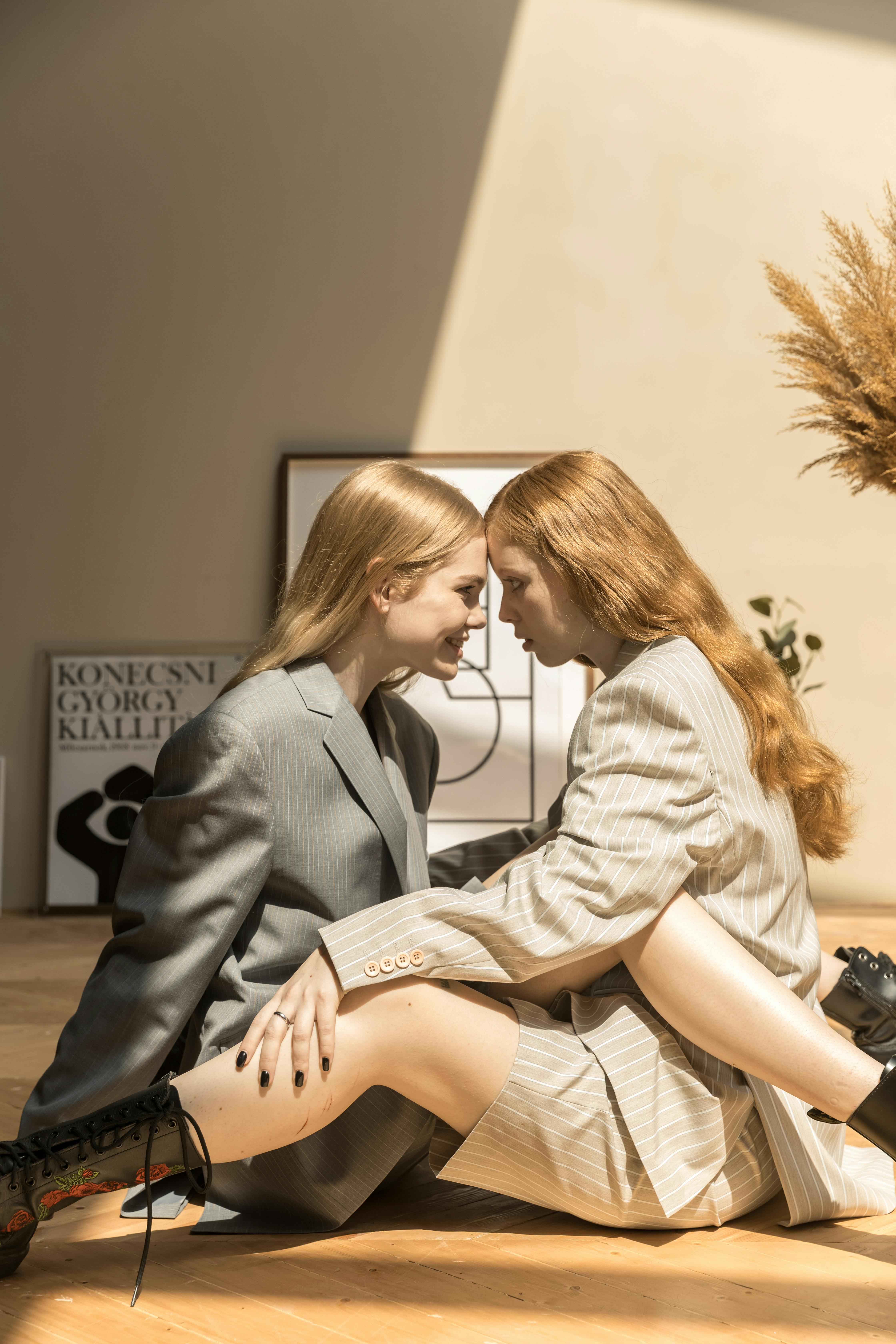 Two Women Sitting Face to Face · Free Stock Photo