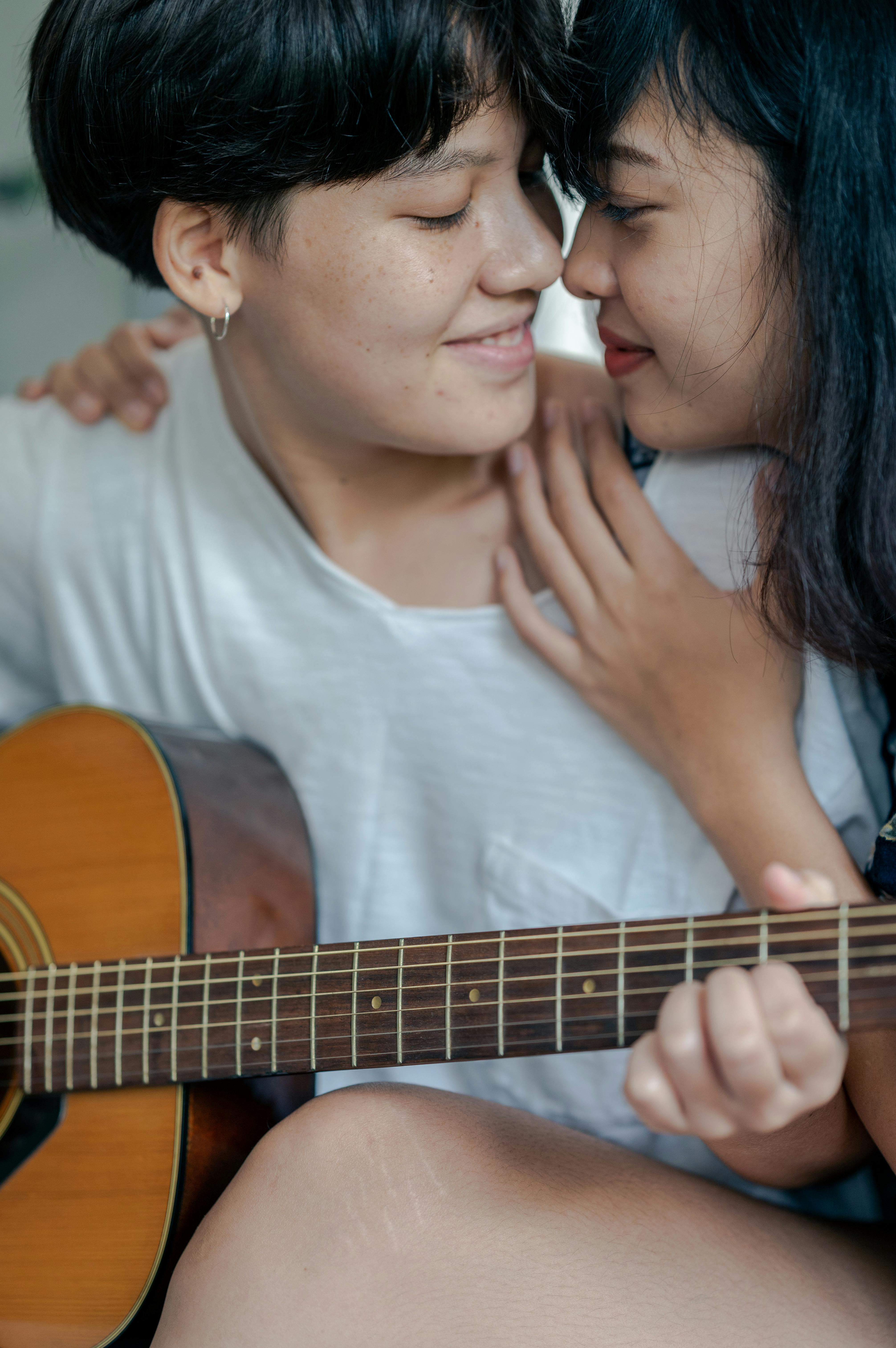 Women Playing Guitar Together · Free Stock Photo