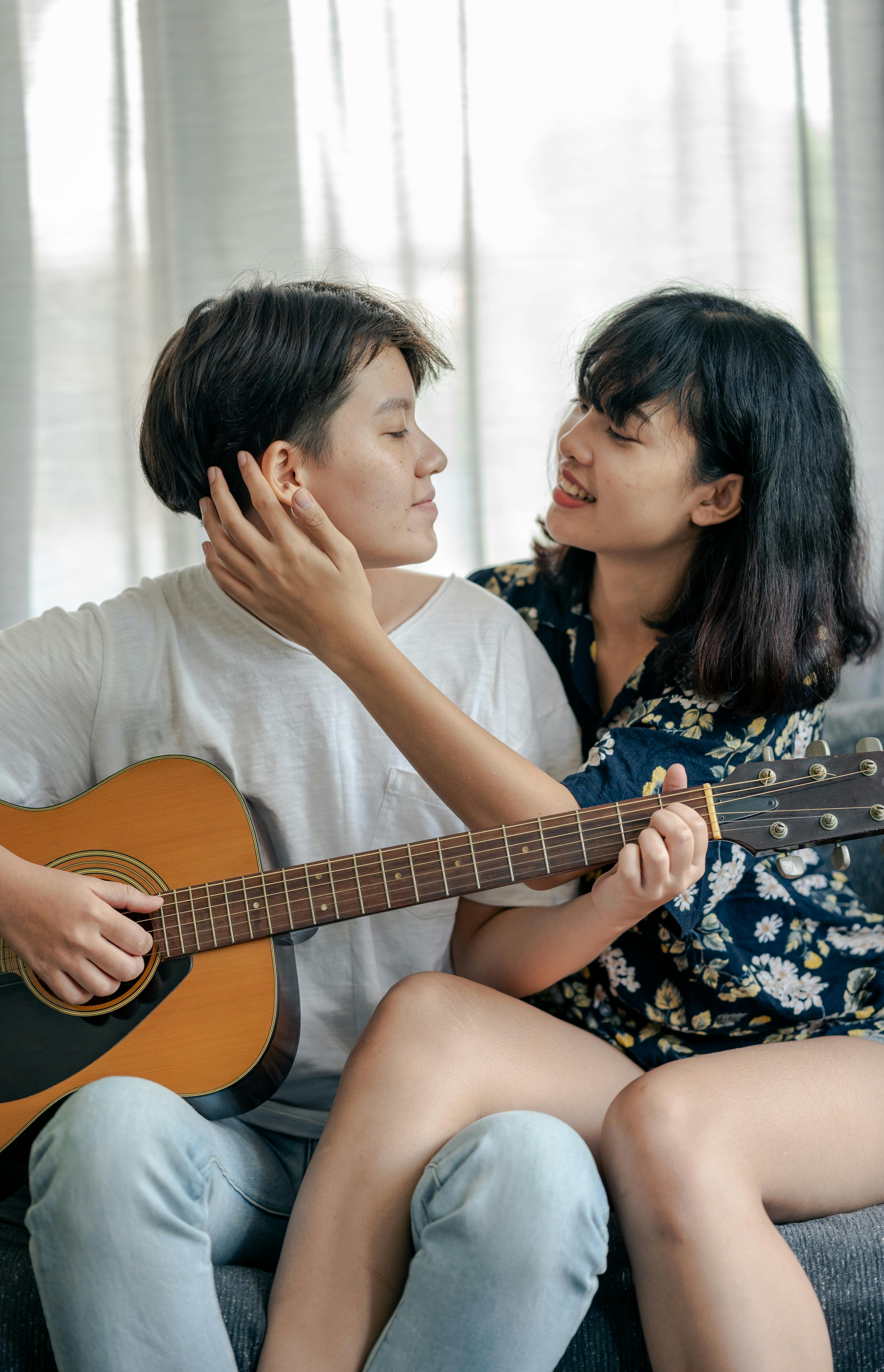 Two Women Playing Guitar · Free Stock Photo