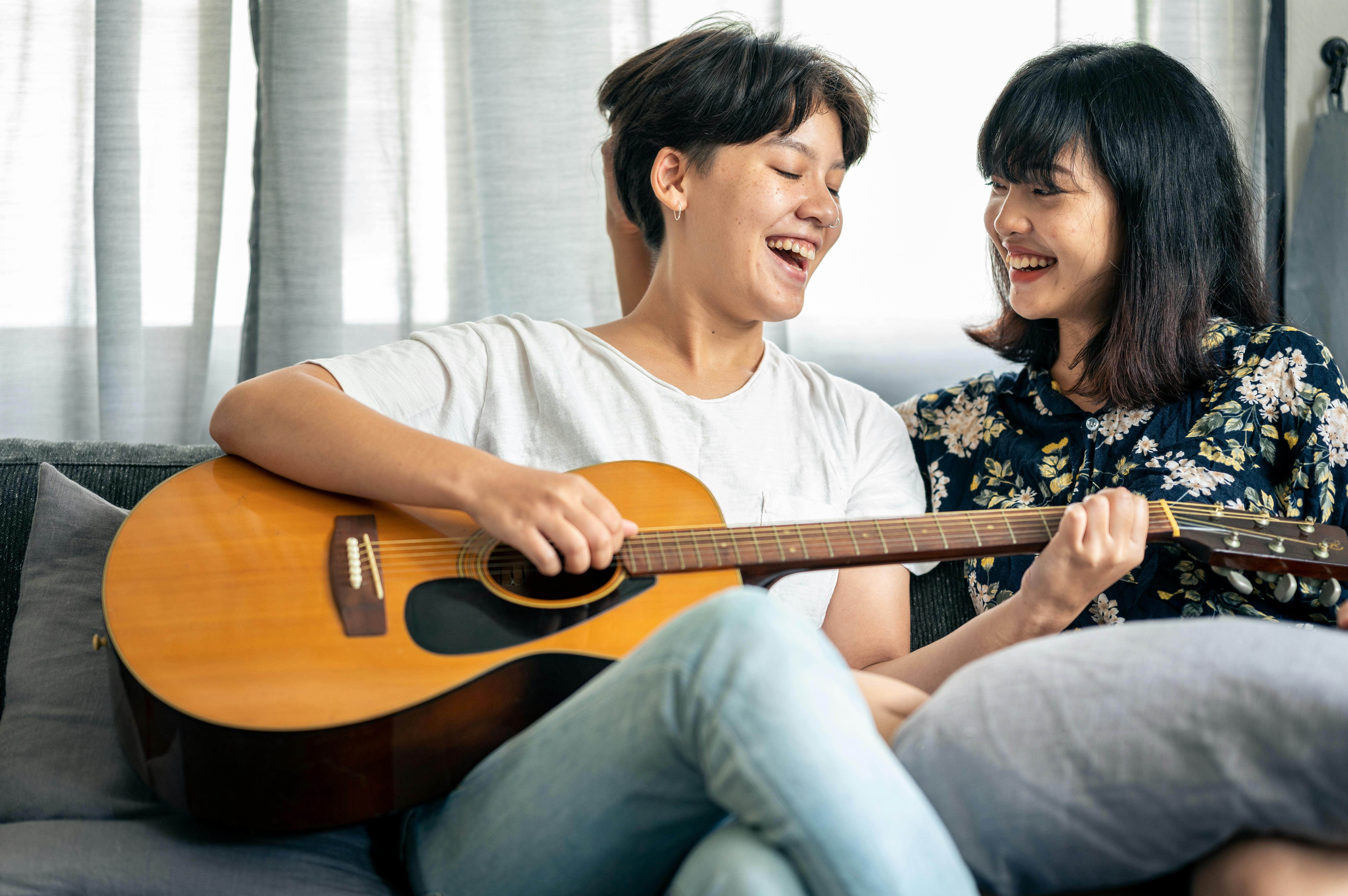 Two Women Playing Guitar · Free Stock Photo