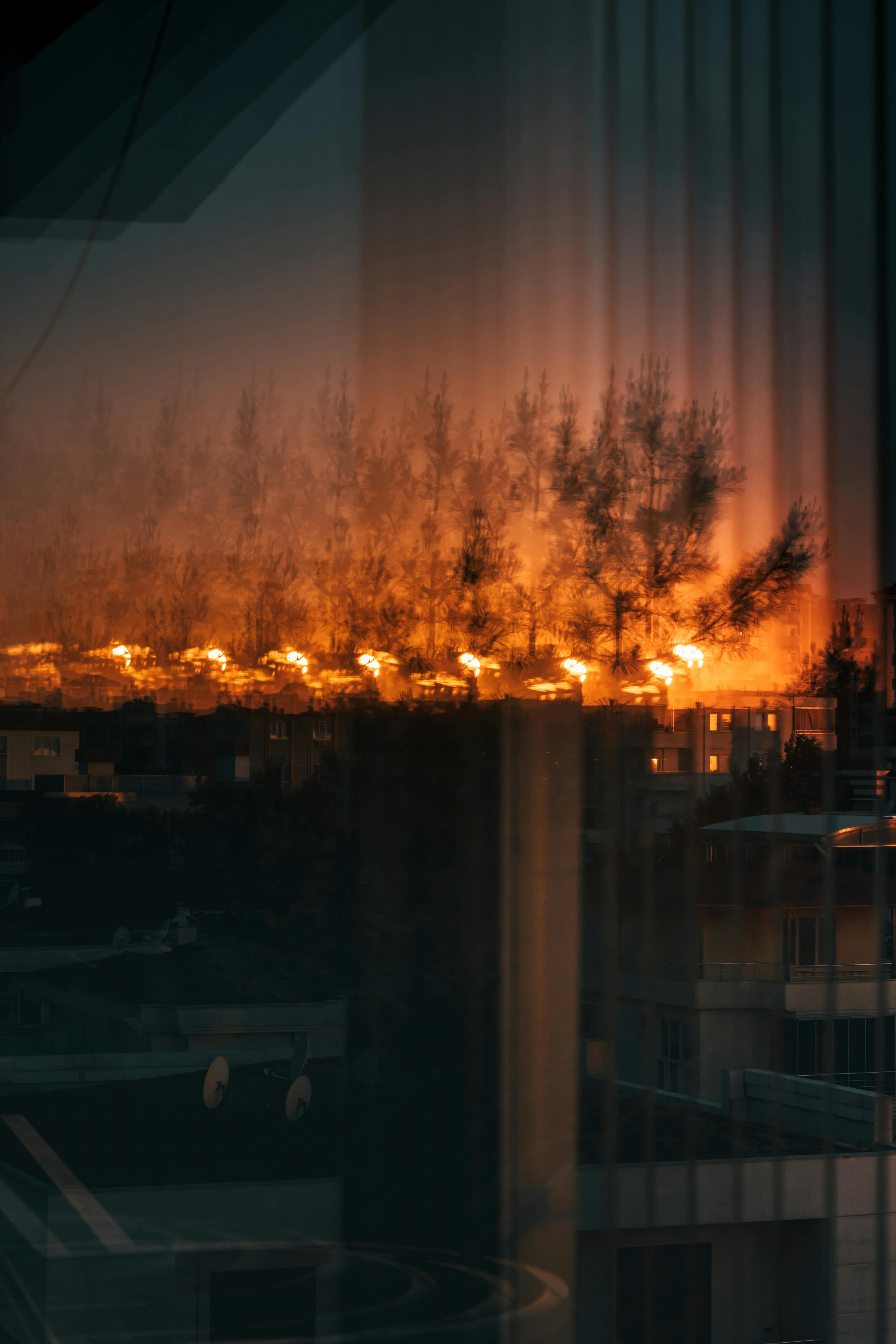 Wildfire at Night Seen Through Window · Free Stock Photo