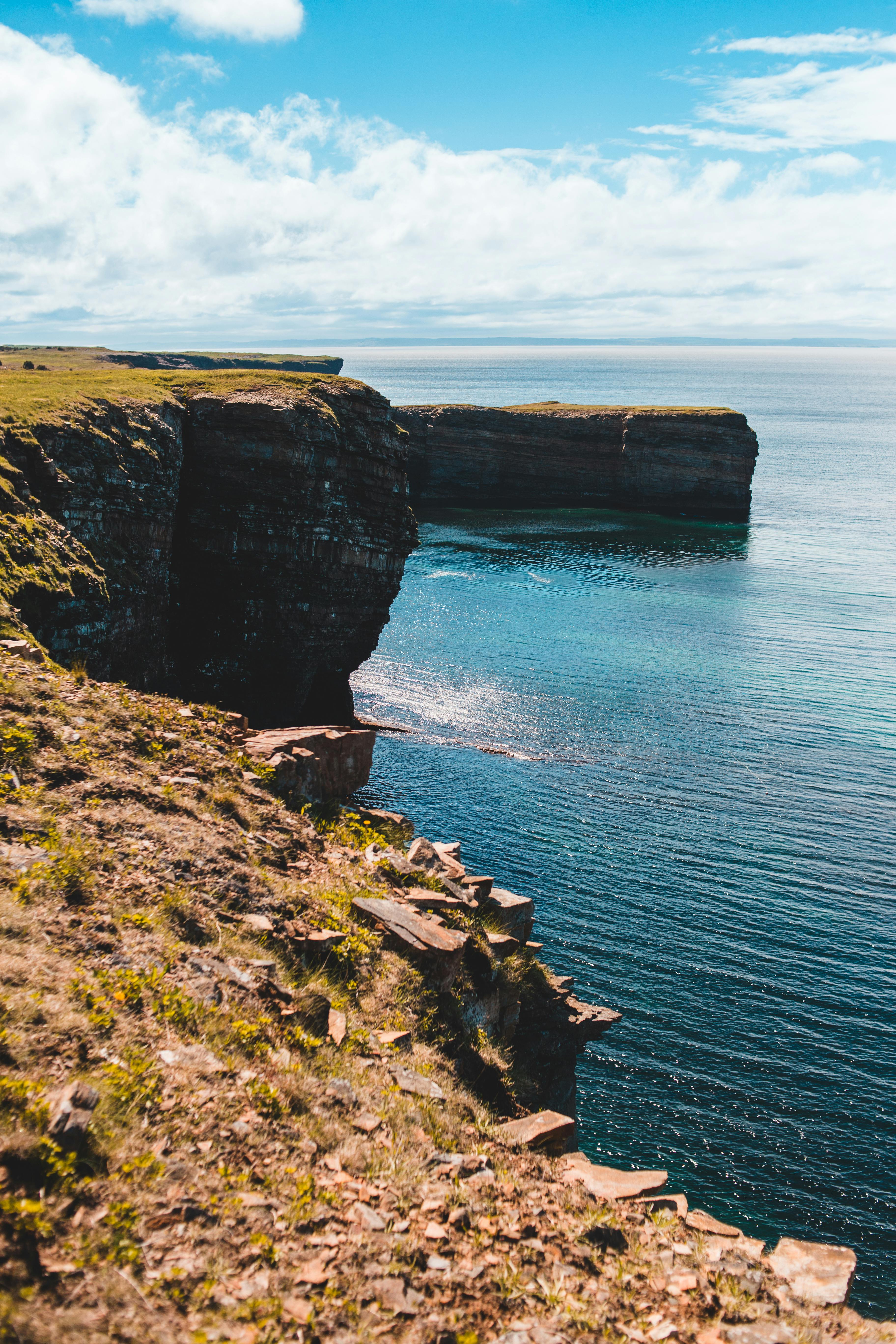 2 Green-and-gray Islet on Body of Water · Free Stock Photo