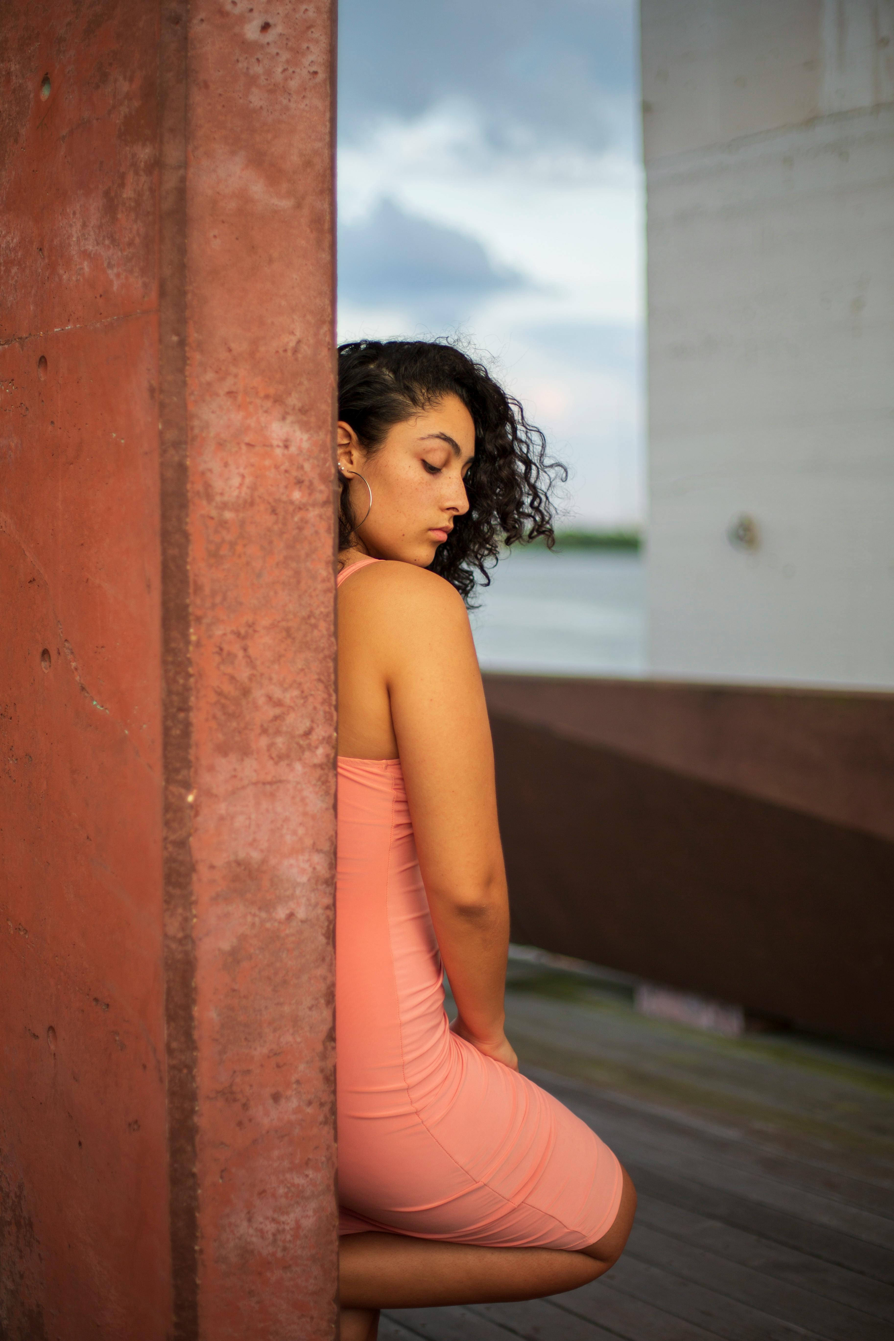 Female Model Wearing a Red Dress Leaning on an Underwater Bench · Free ...