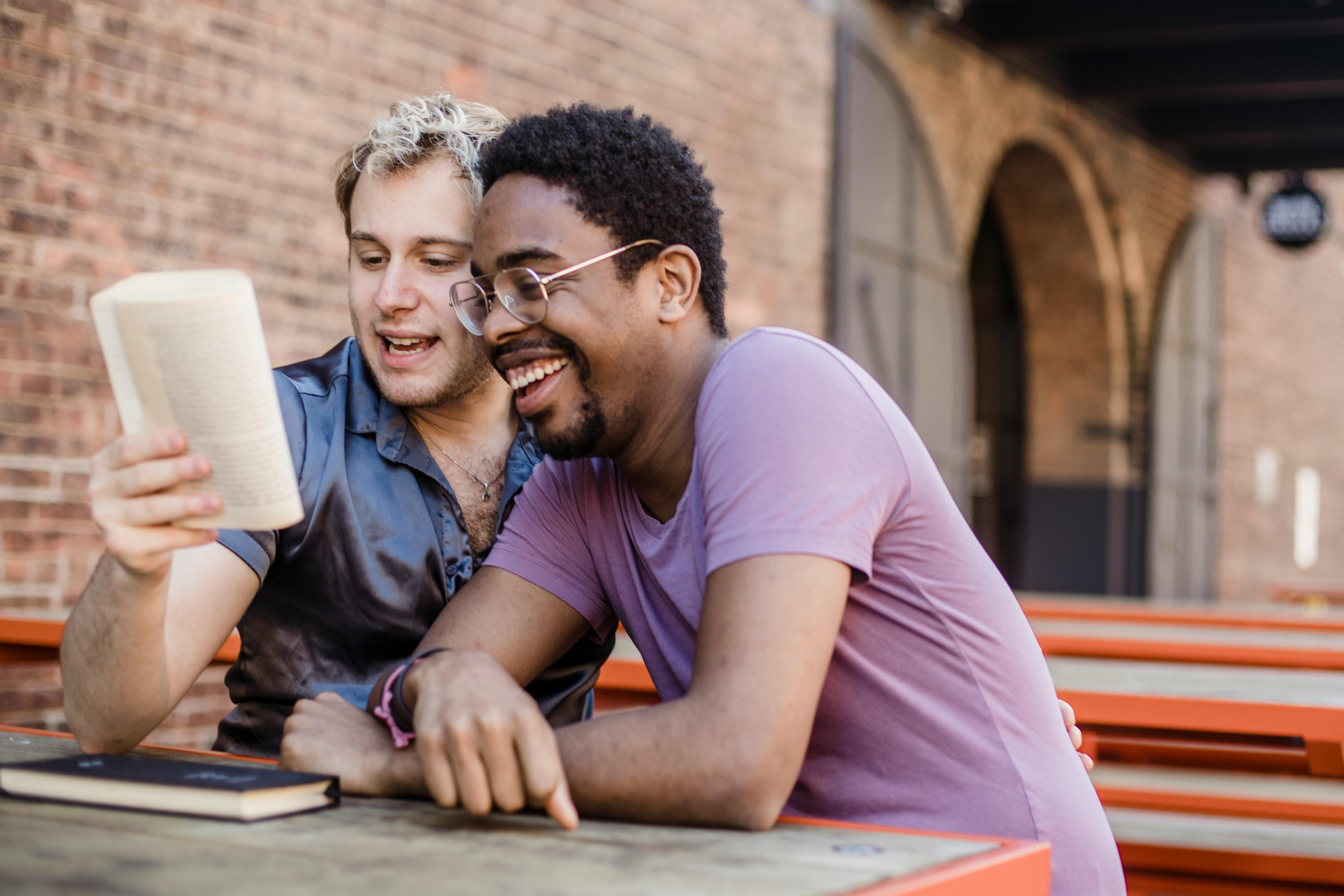 Two Men Reading a Book · Free Stock Photo