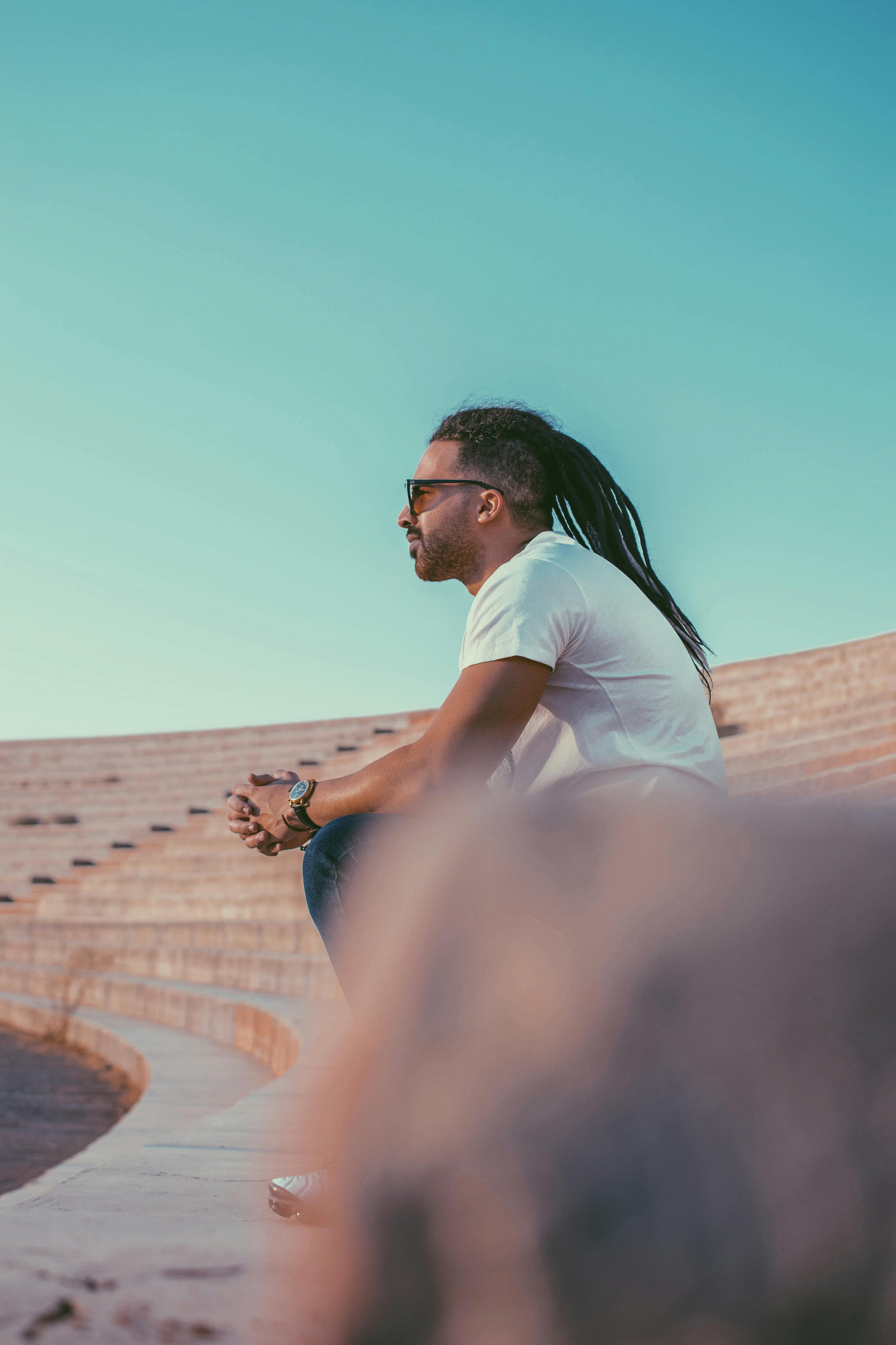 Portrait of a Man Sitting Down · Free Stock Photo