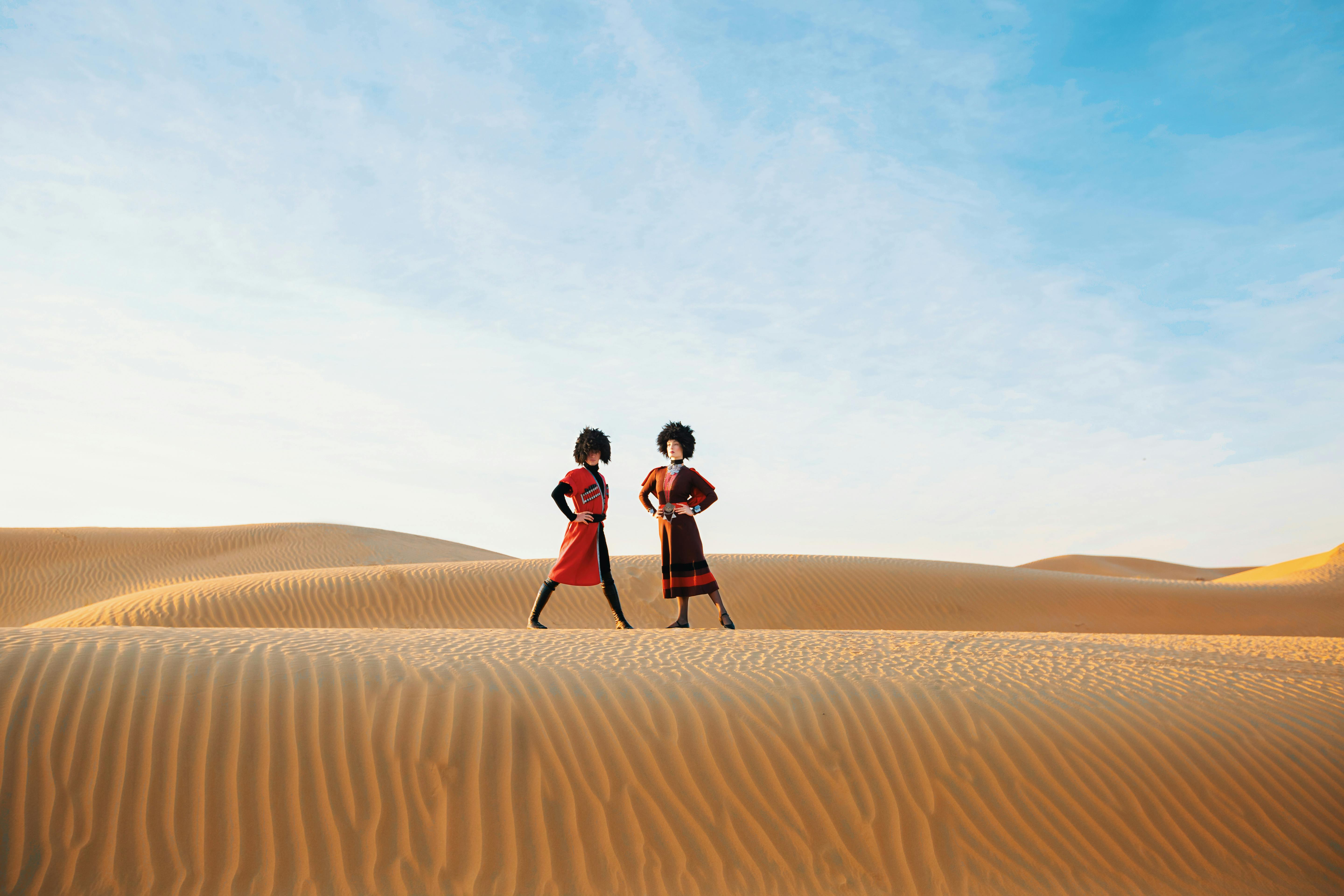 Two Person Standing on Desert · Free Stock Photo
