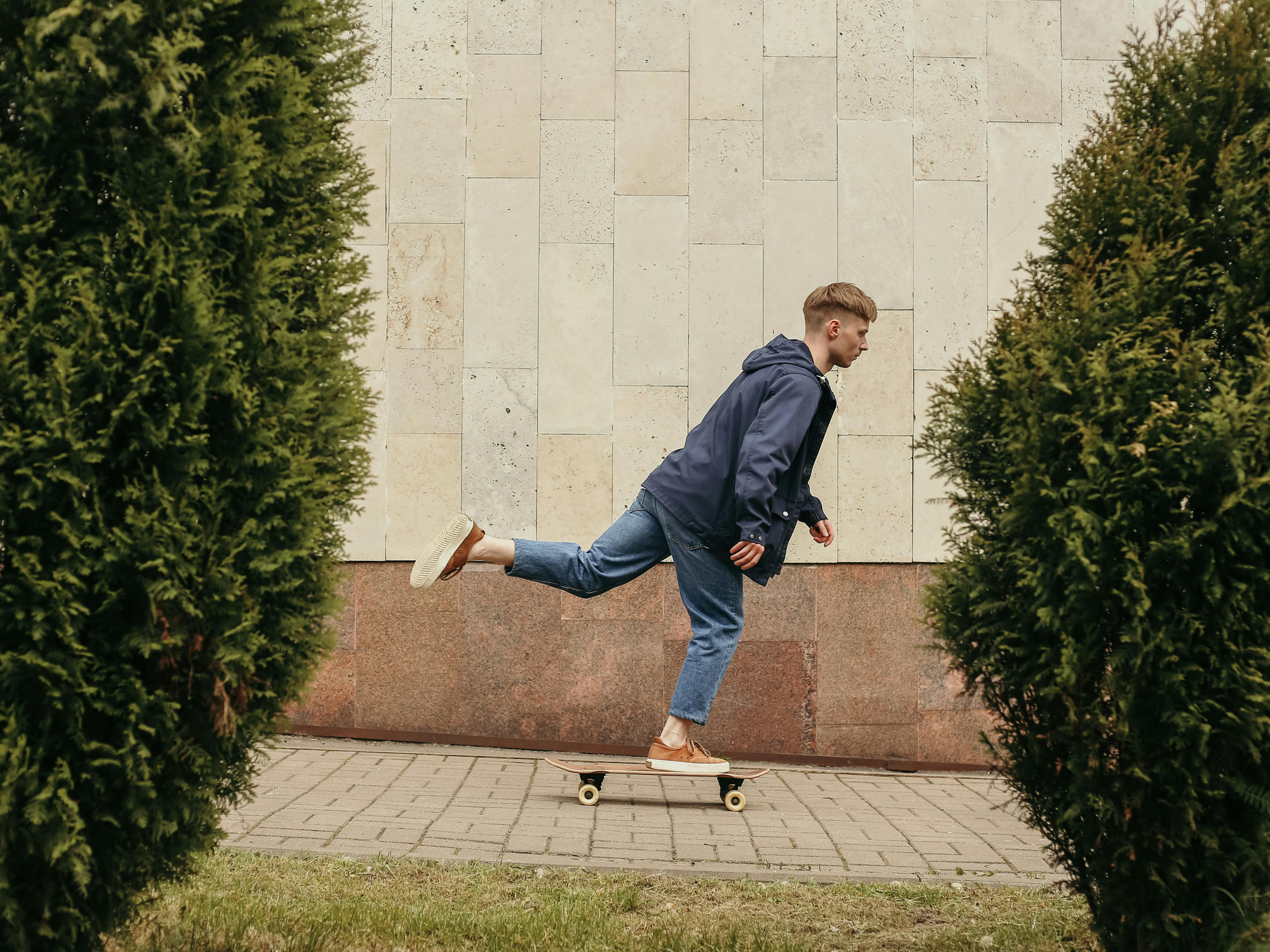 Man Riding a Penny Board · Free Stock Photo