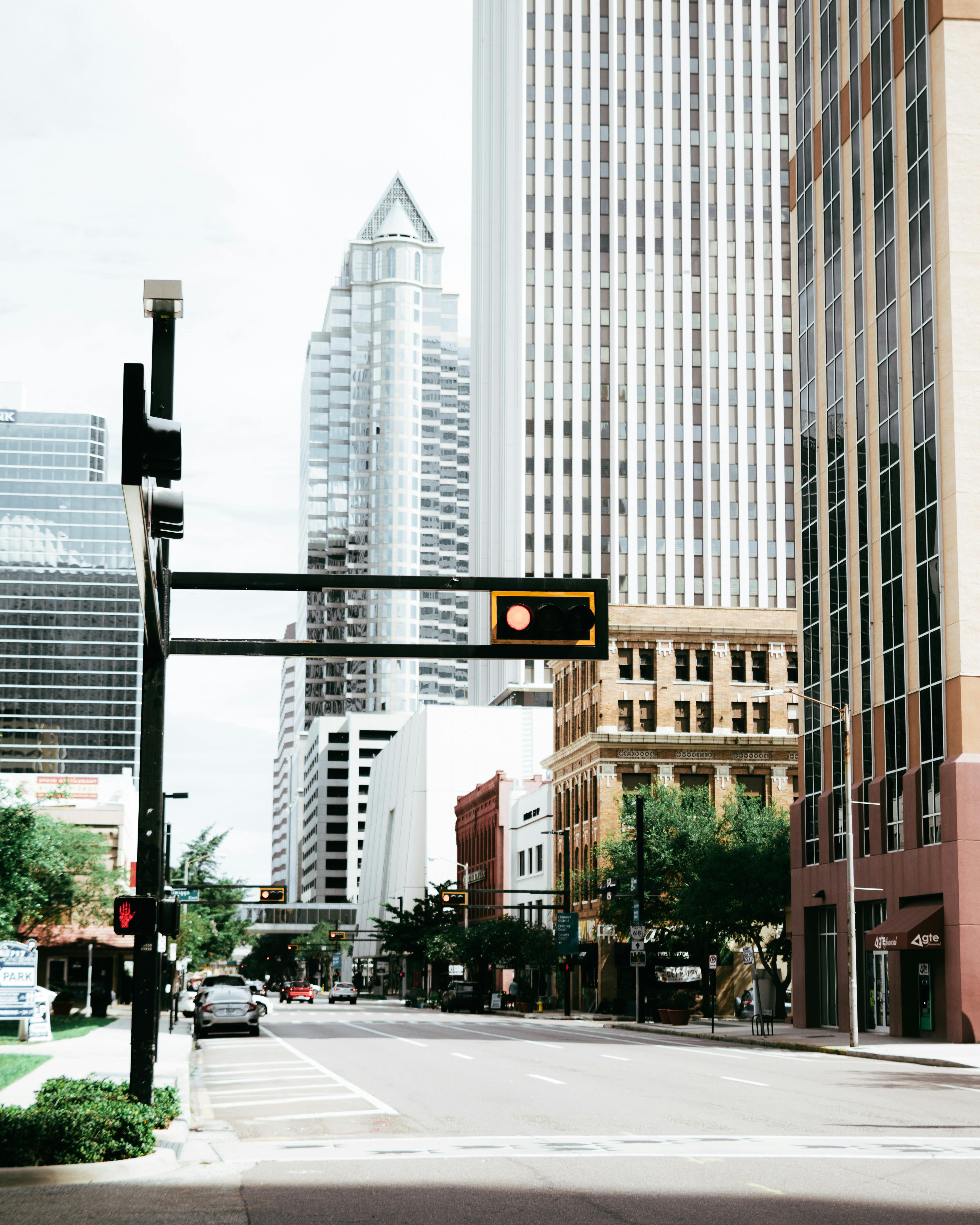 Stoplight in the City with Tall Buildings · Free Stock Photo