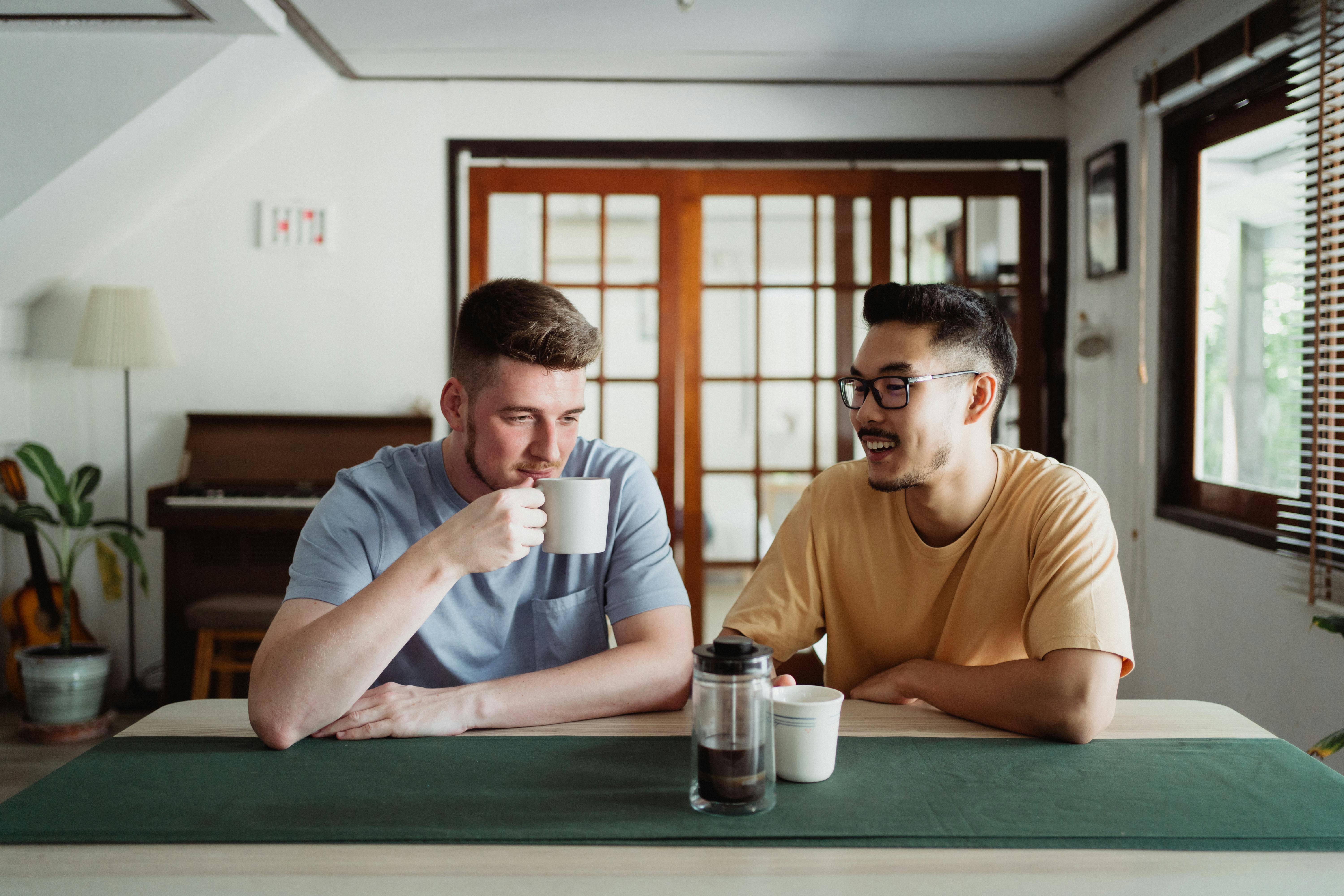 Men Drinking Coffee and Talking · Free Stock Photo