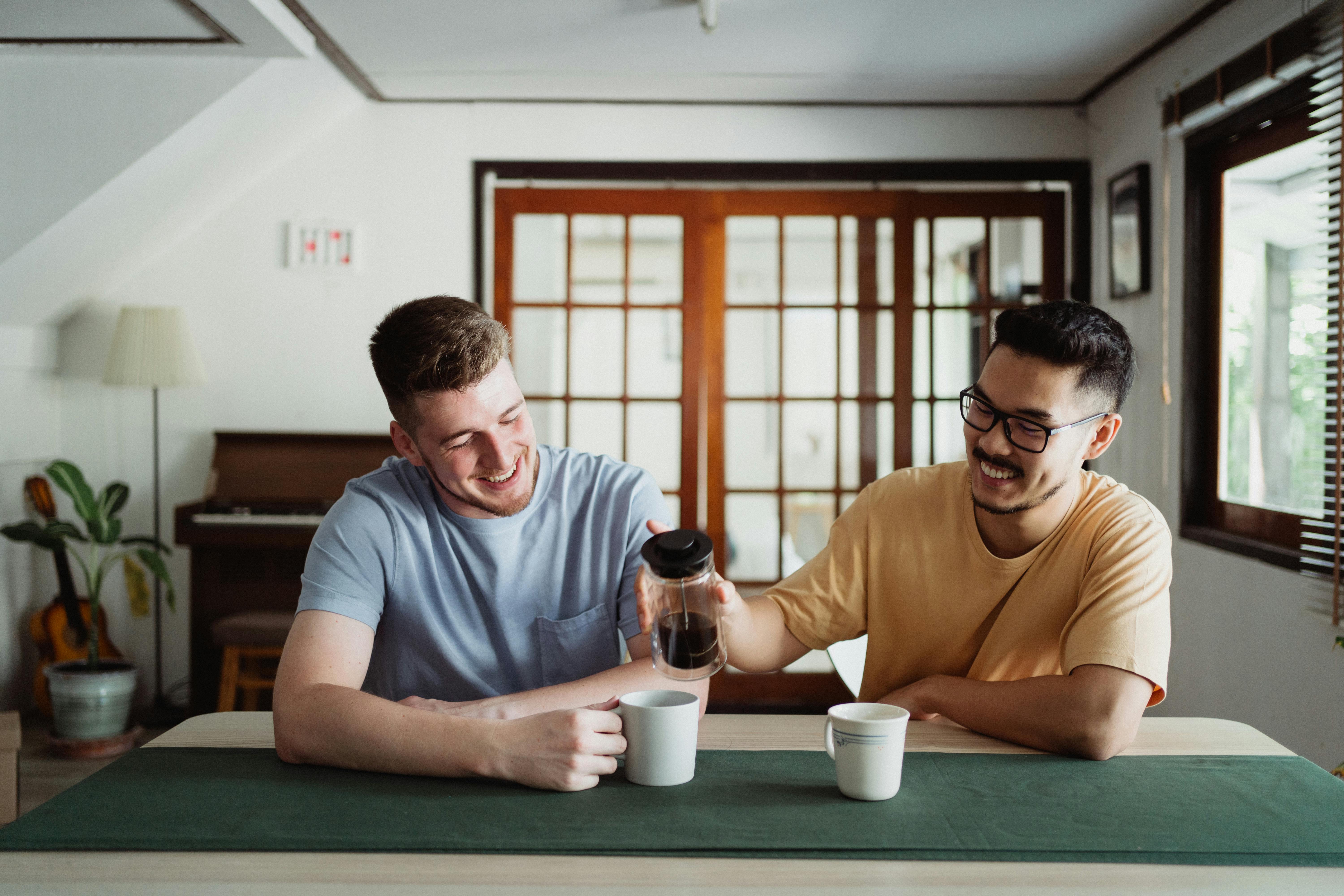 Men Drinking Coffee and Talking · Free Stock Photo