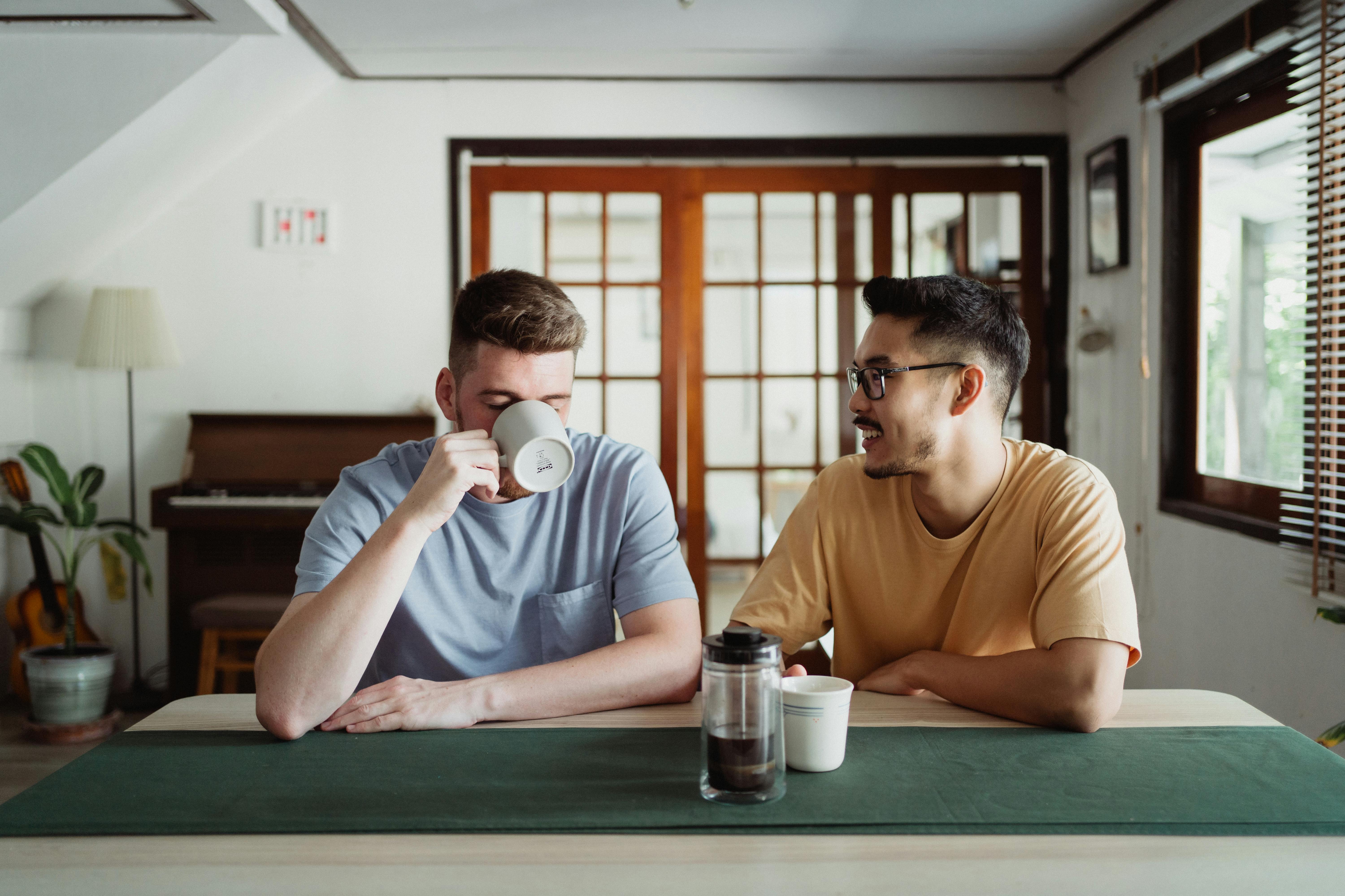 Men Sitting and Drinking Coffee · Free Stock Photo