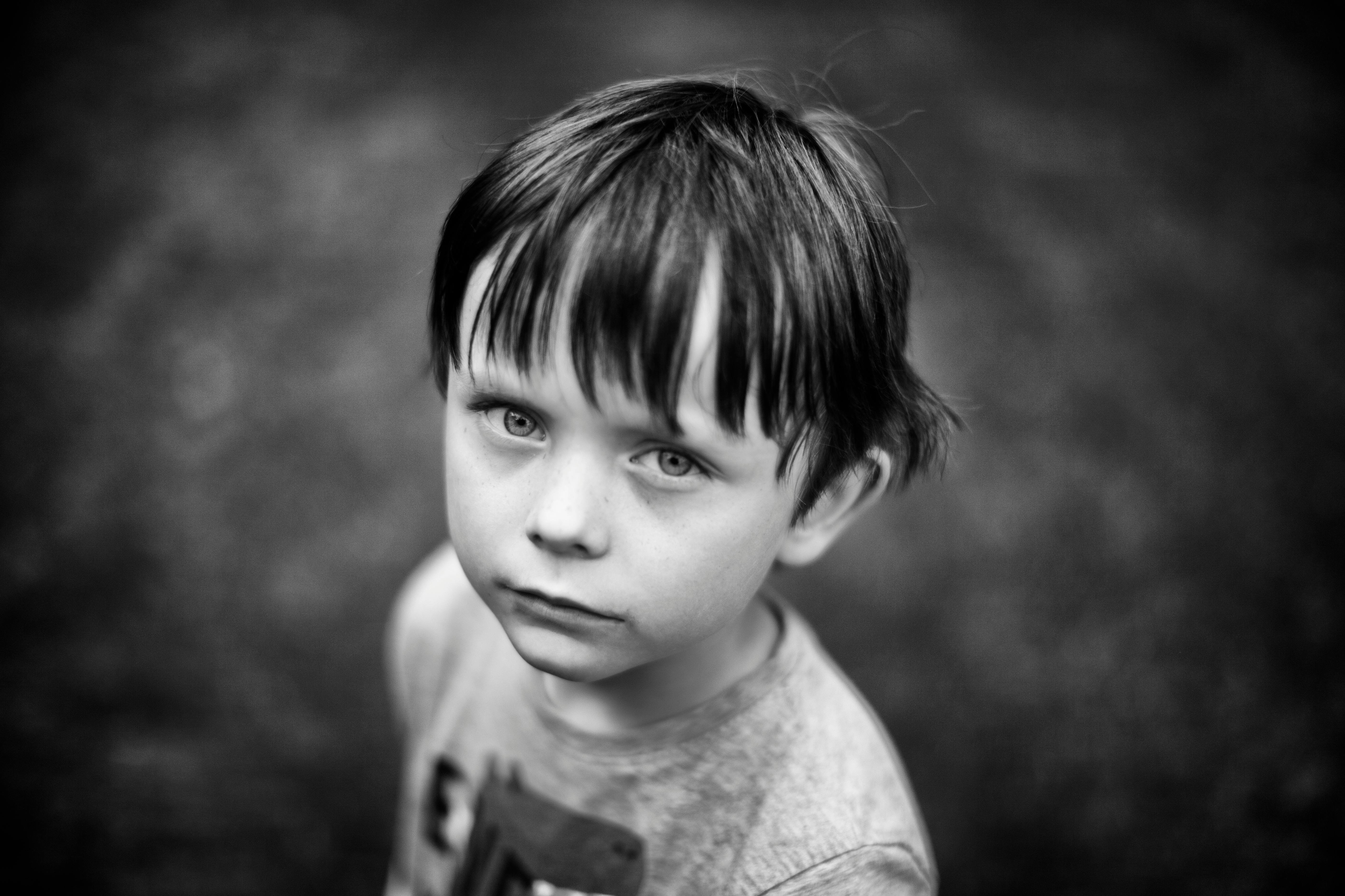 Grayscale Photo of a Boy with Serious Face · Free Stock Photo