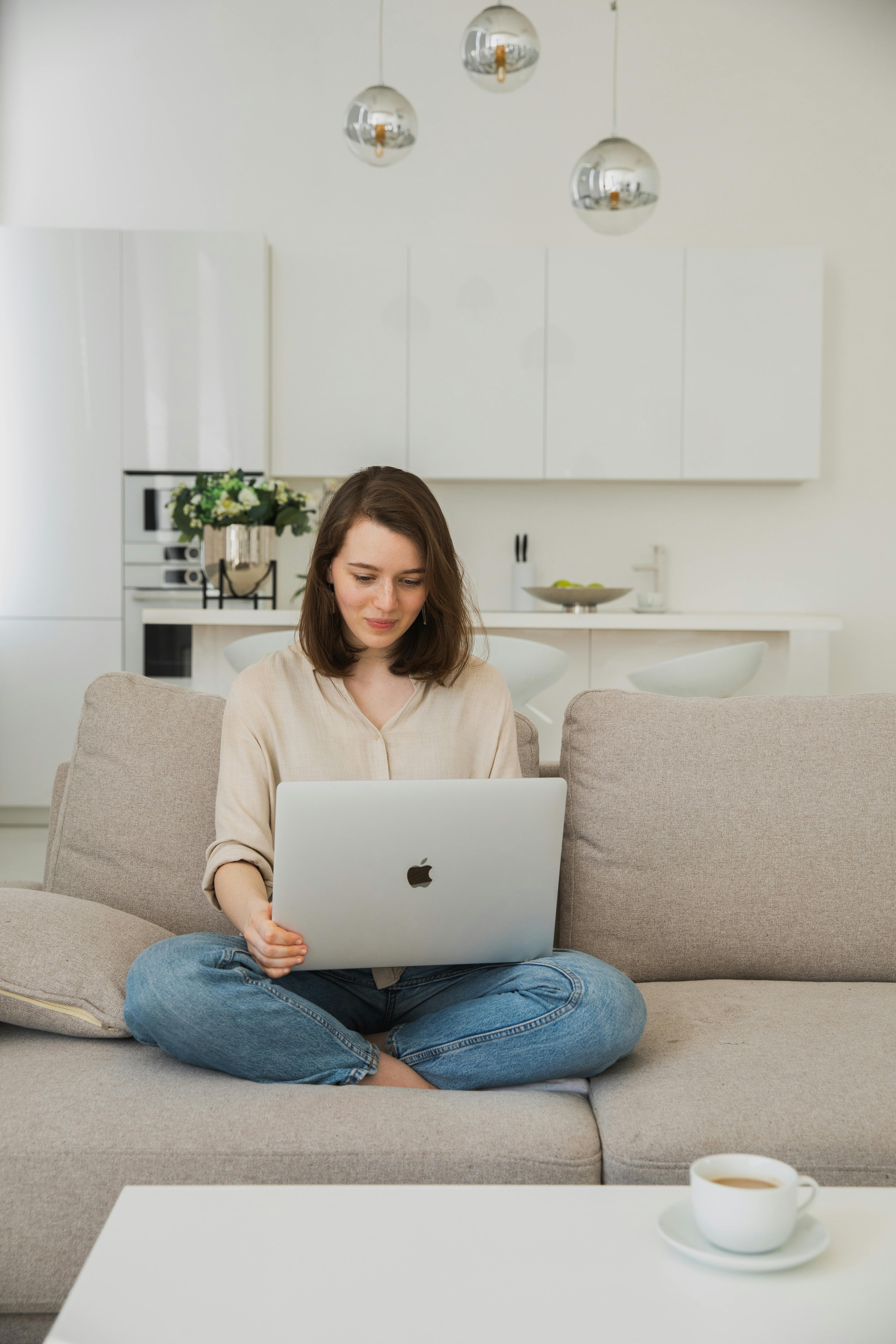 Person Using Macbook Pro On Person's Lap · Free Stock Photo