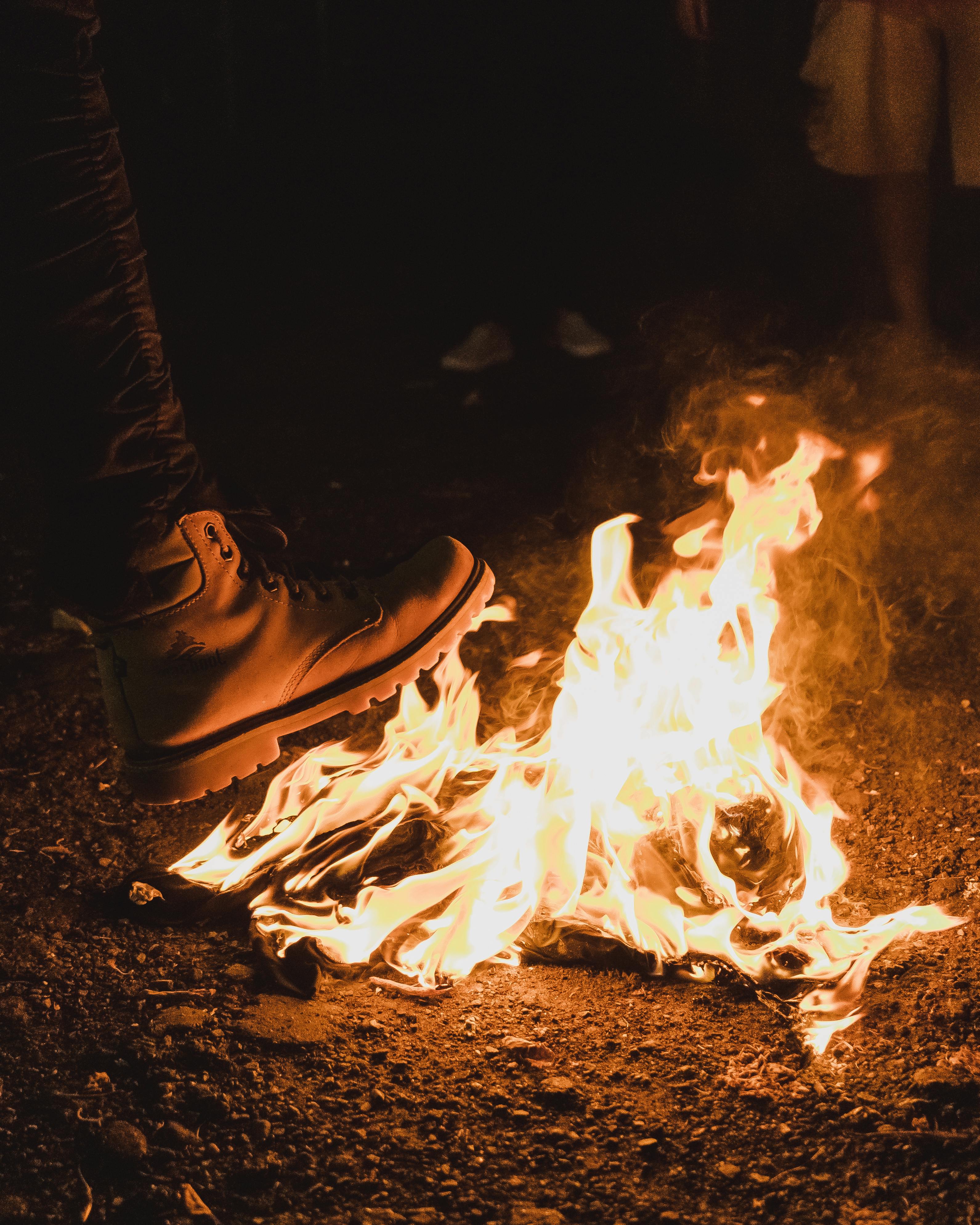 Photo of a Person's Foot Near Flames · Free Stock Photo