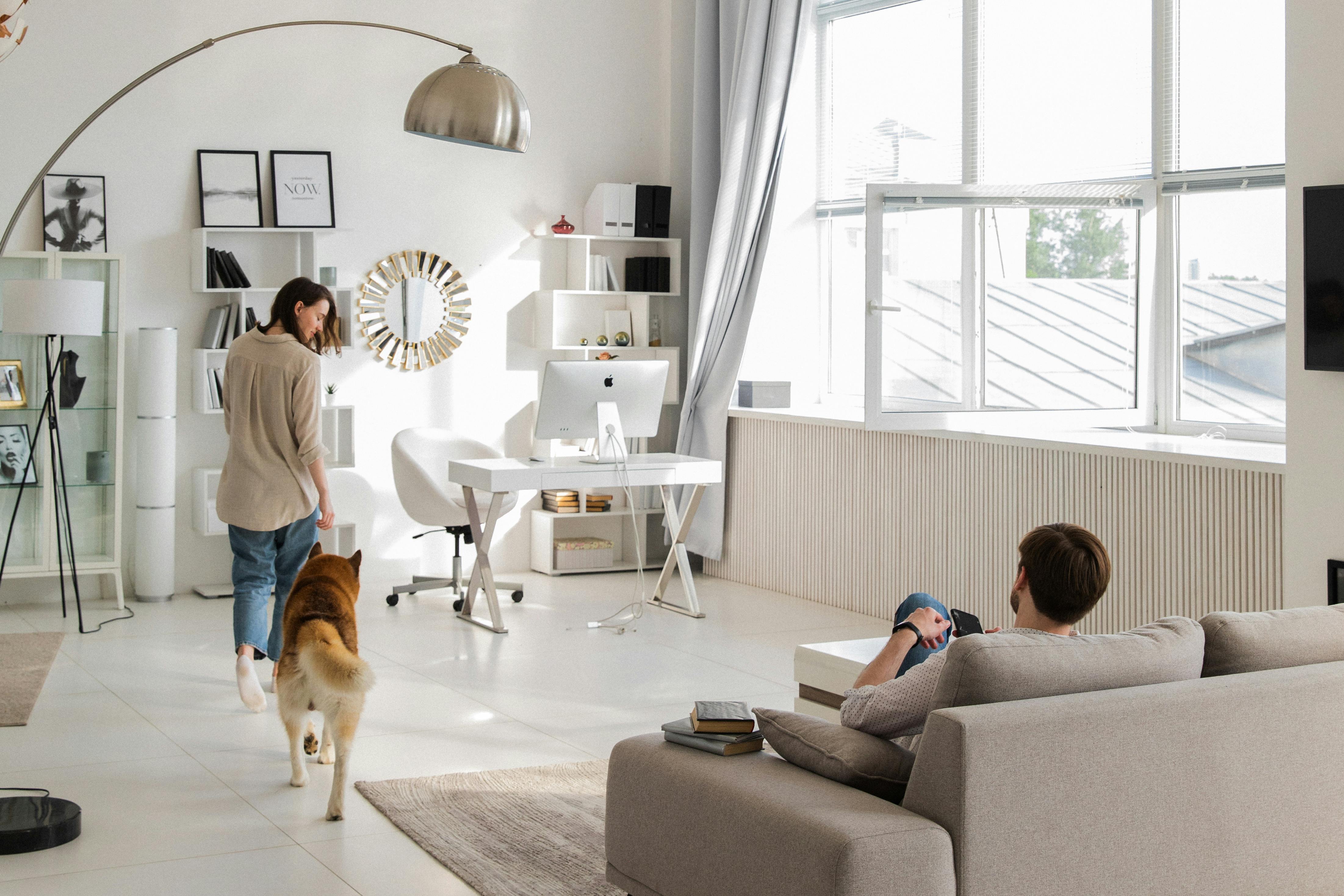 Couple and Dog in Room · Free Stock Photo