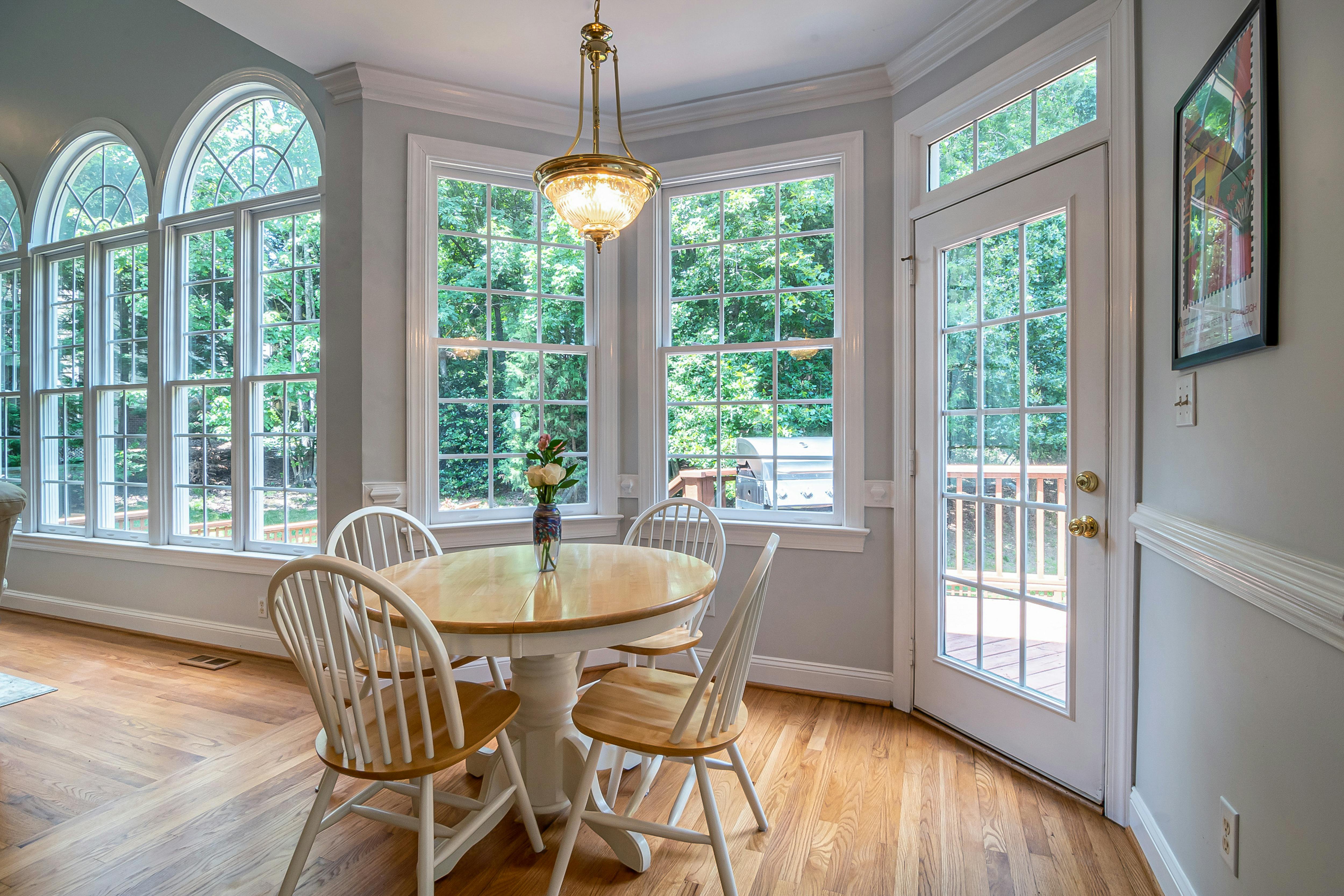 Brown Wooden Round Table With Chairs · Free Stock Photo