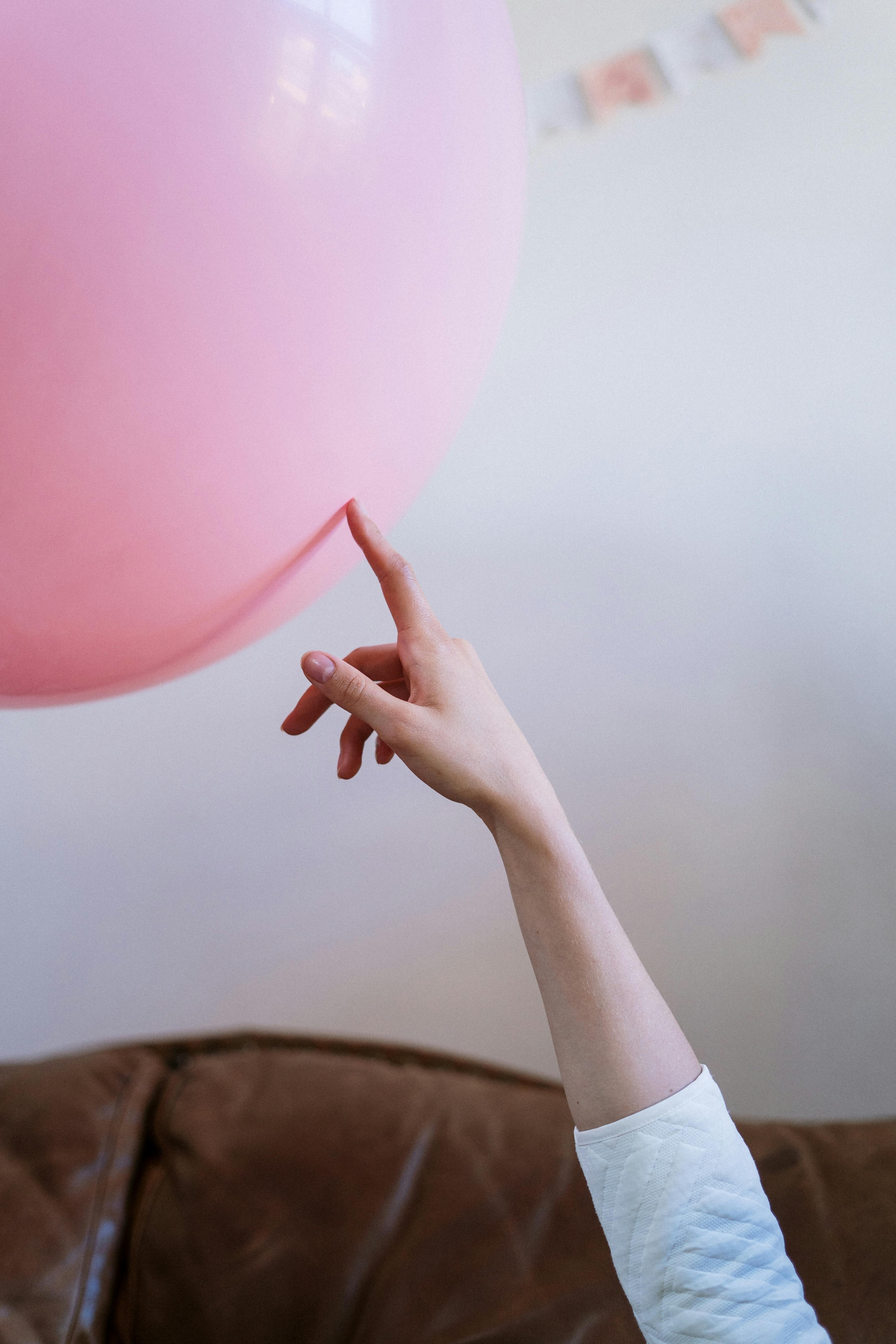 Person Holding Pink Balloon · Free Stock Photo