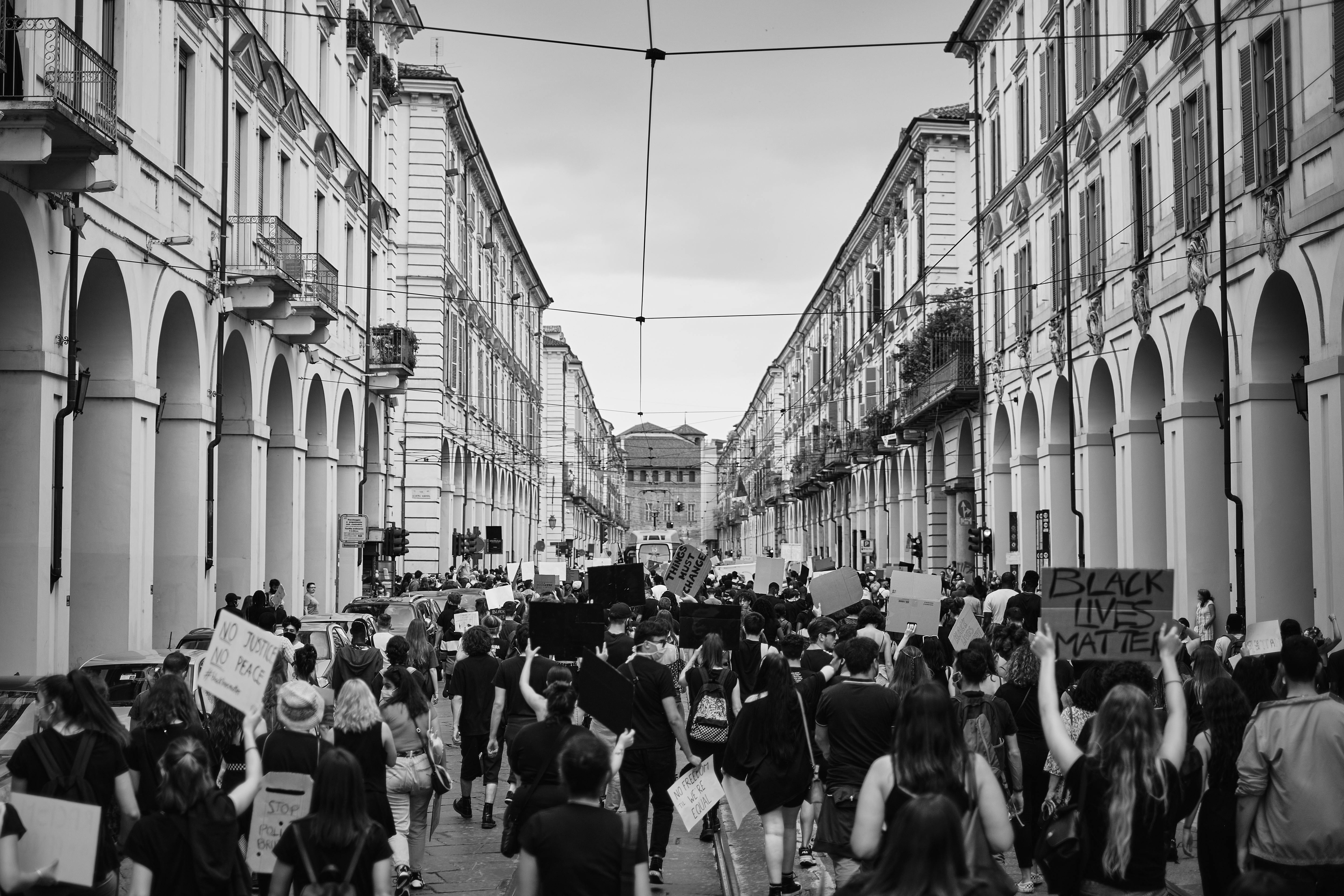 Grayscale Photo of People Protesting on the Street · Free Stock Photo