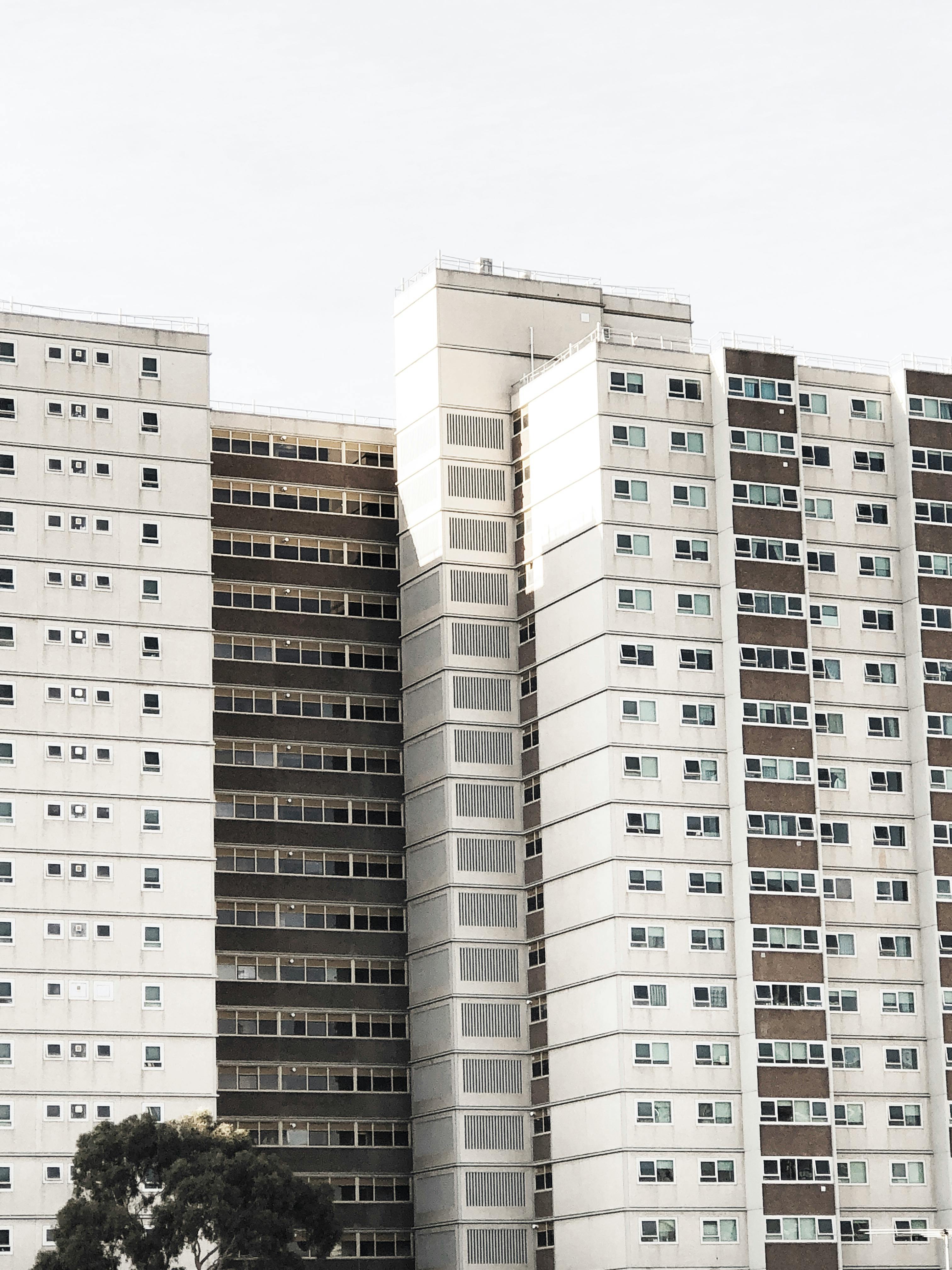Photo of a White and Brown Commercial Building · Free Stock Photo