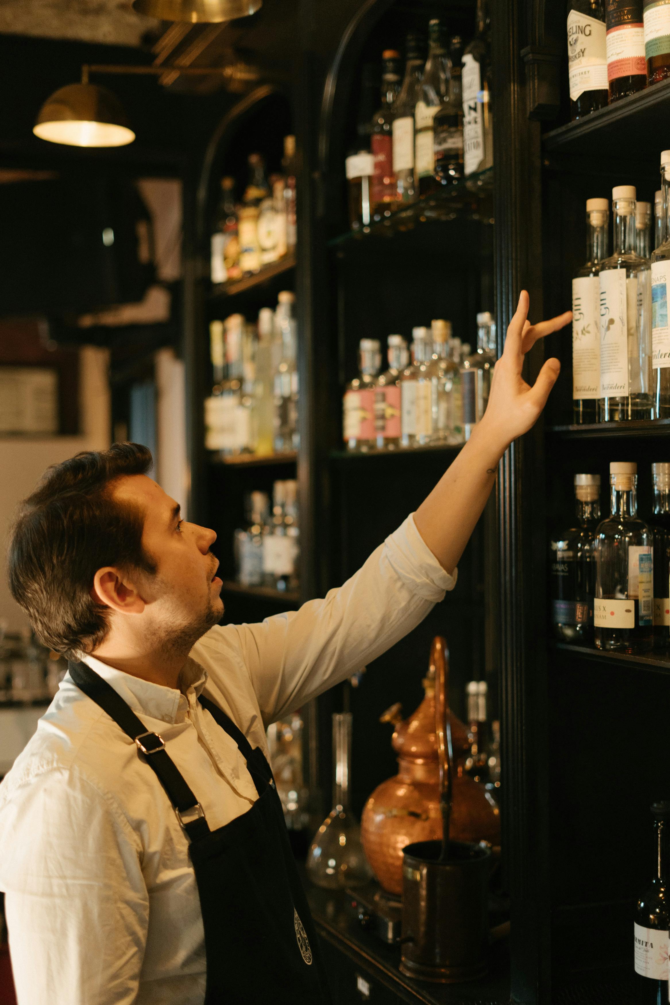 Bar Staff Arranging Drinks In Shelves Photos, Download The BEST Free ...