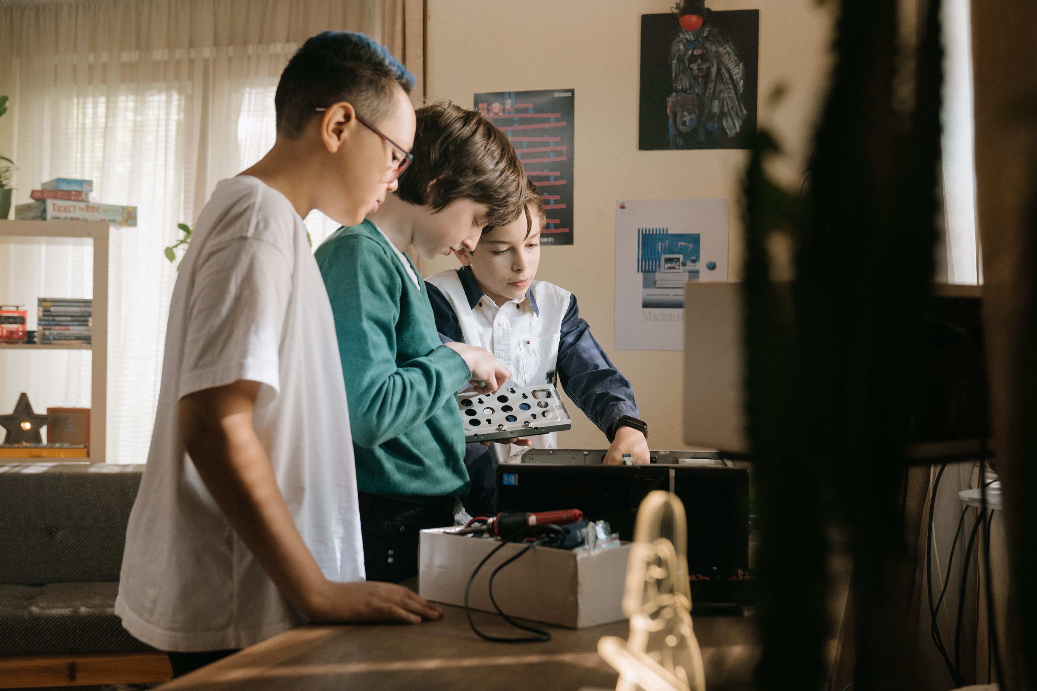 Boy Wearing Blue T Shirt Using Black Laptop Computer in a Dim Lighted ...