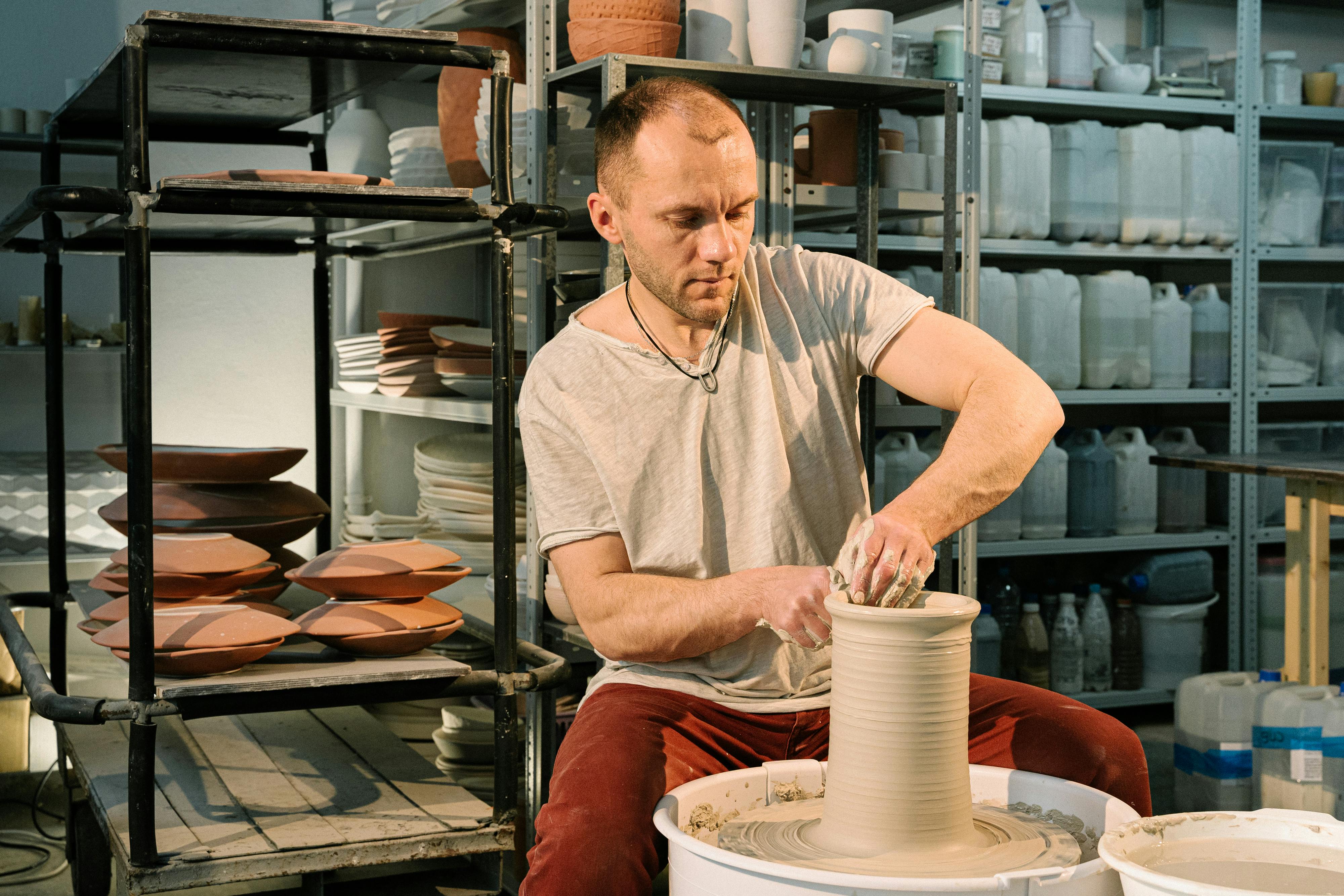 A Man Molding a Clay Pot · Free Stock Photo