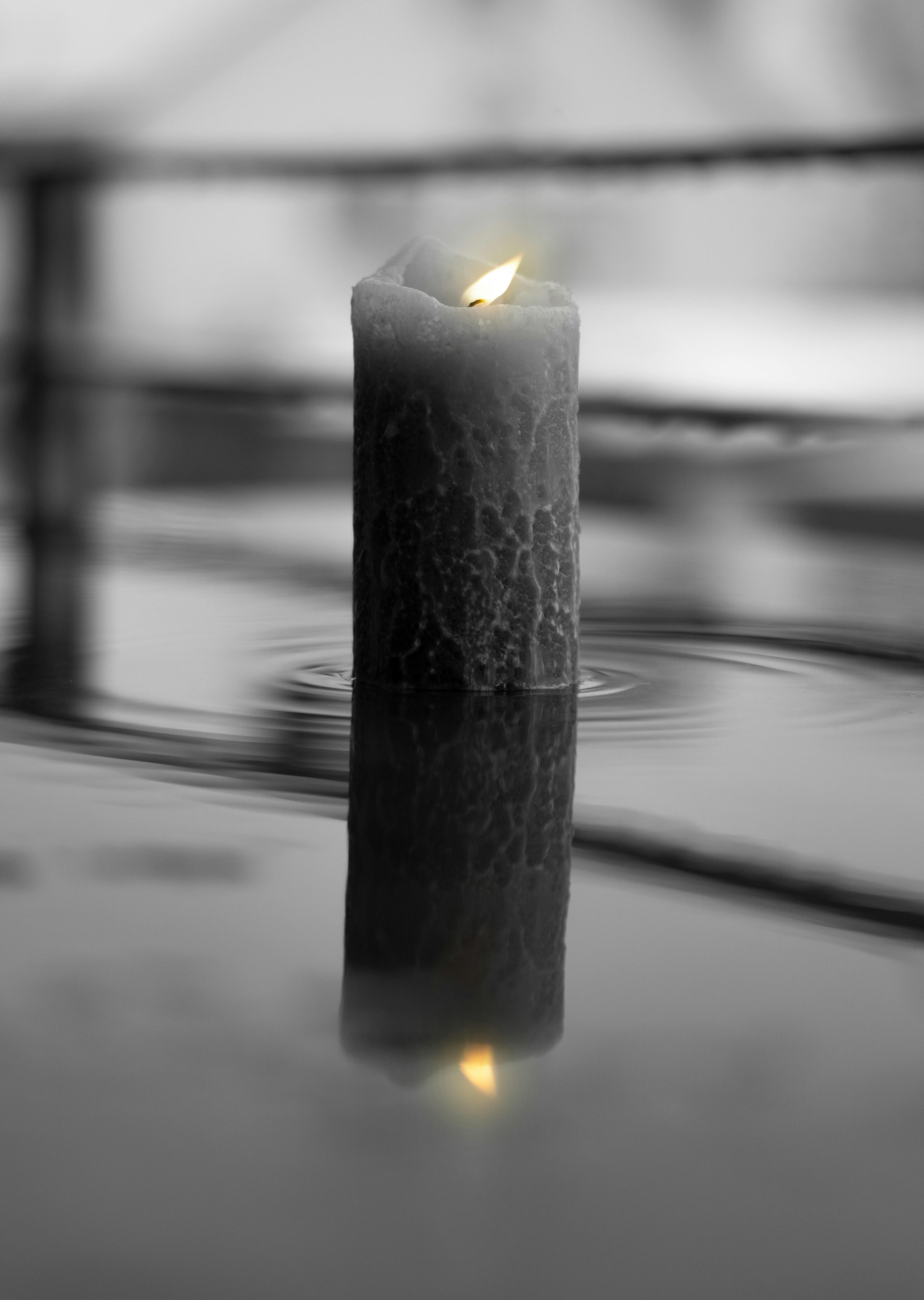 Lighted Candle in Grayscale Photography · Free Stock Photo