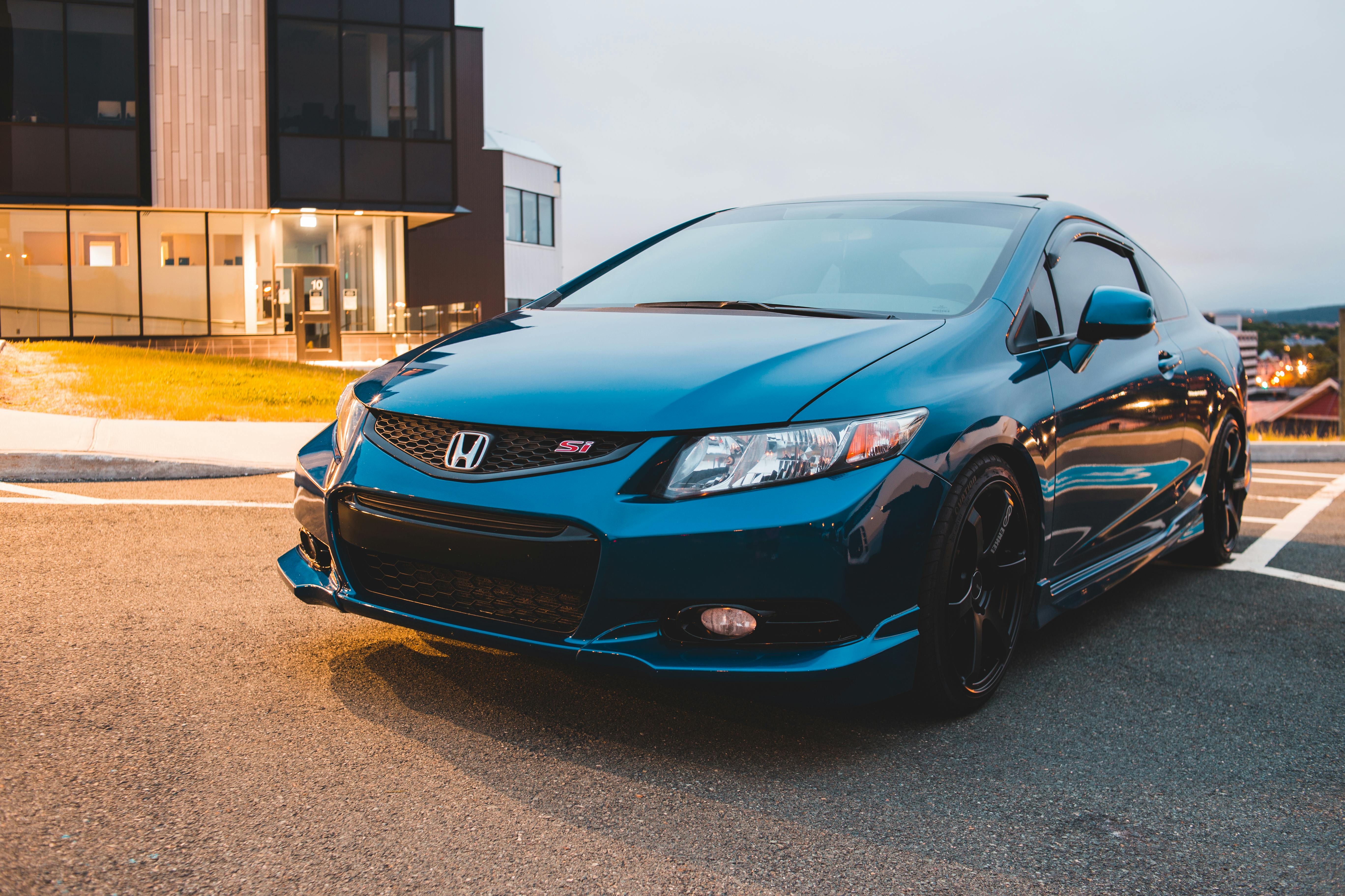 Modern blue car near building in city · Free Stock Photo