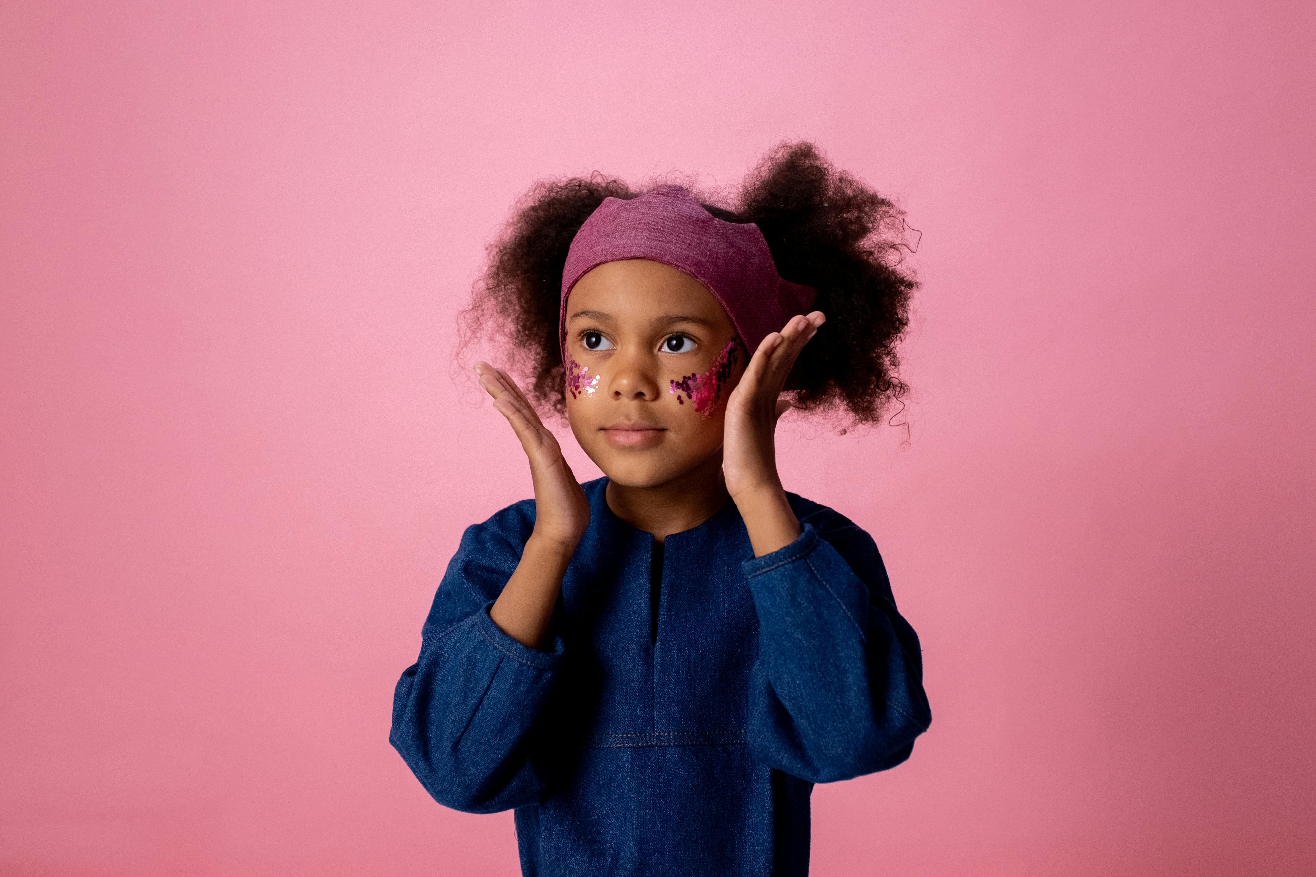 Woman in Blue Long Sleeve Shirt Raising Her Right Hand · Free Stock Photo