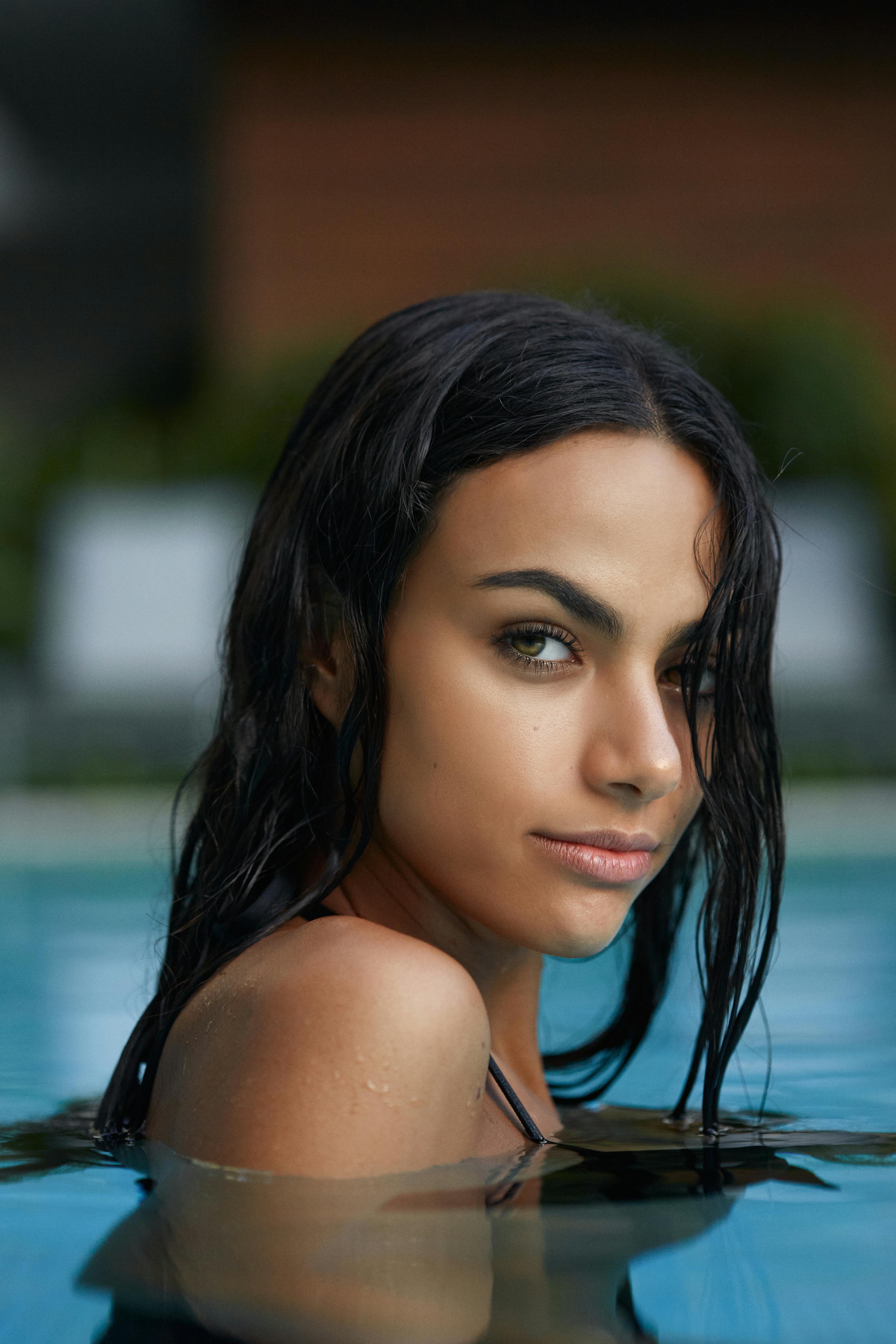 Woman Swimming on a Dug Out Pool · Free Stock Photo