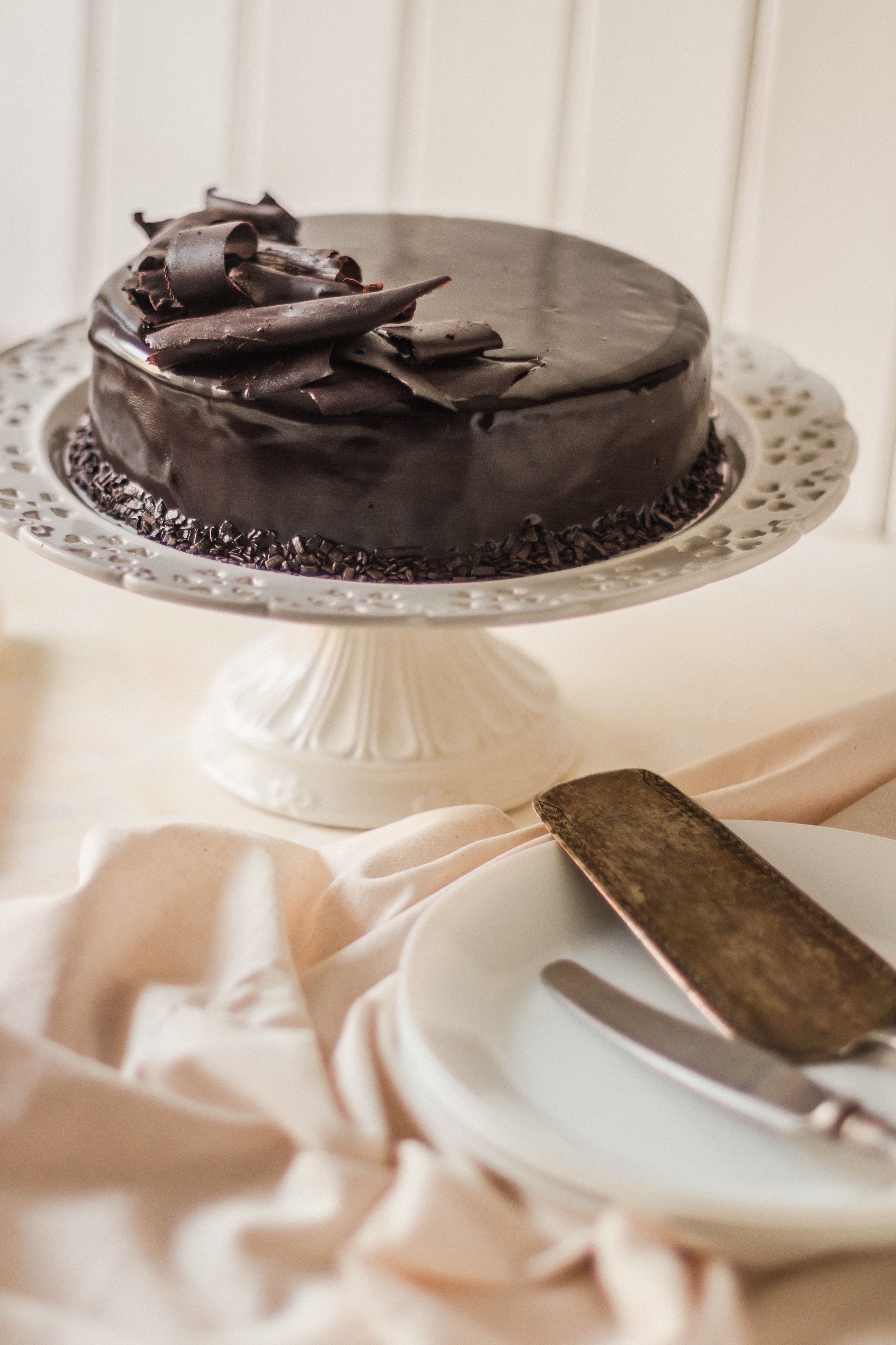 Black cake and old kitchen utensils · Free Stock Photo