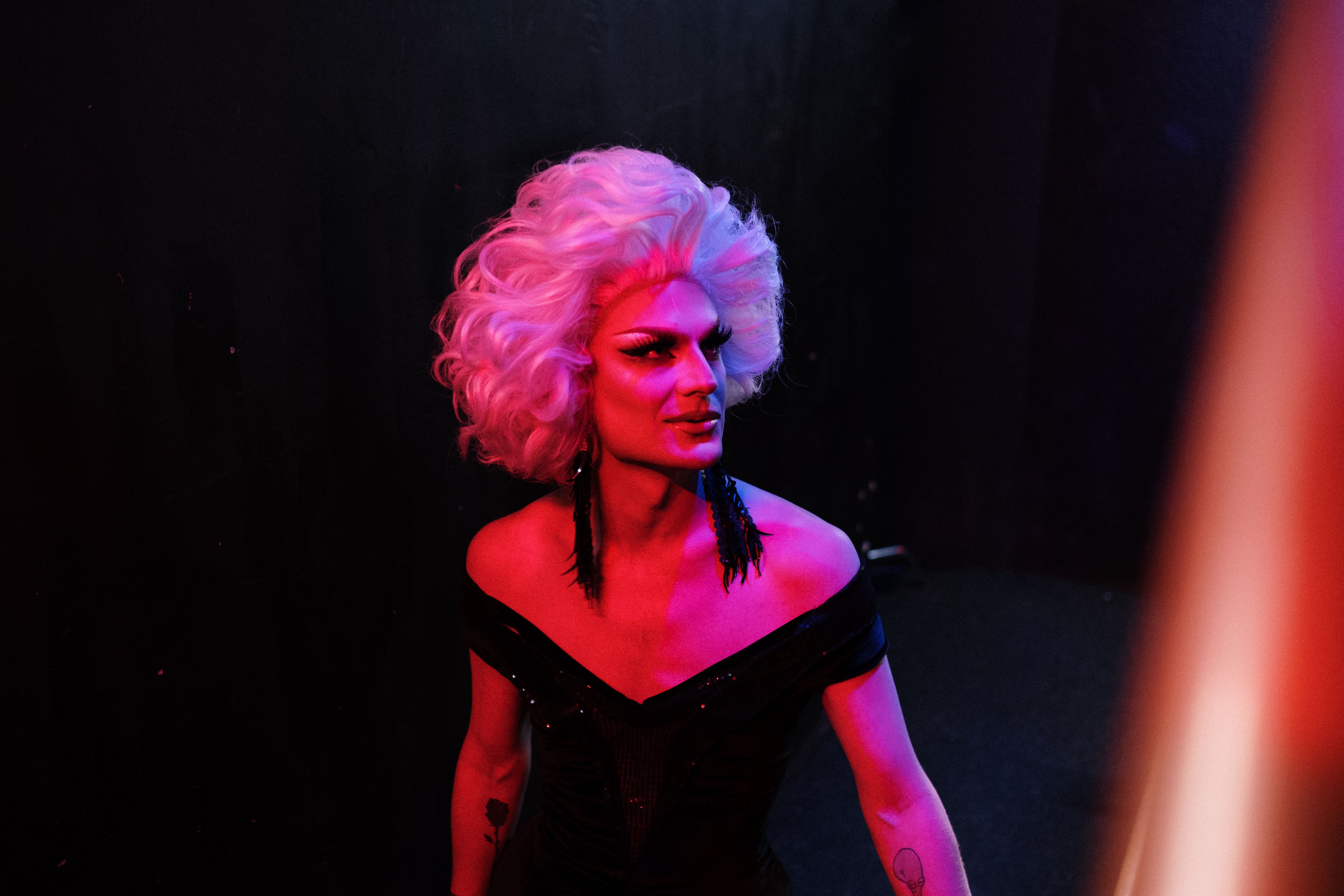 Drag Queen Holding White Hand Fan · Free Stock Photo