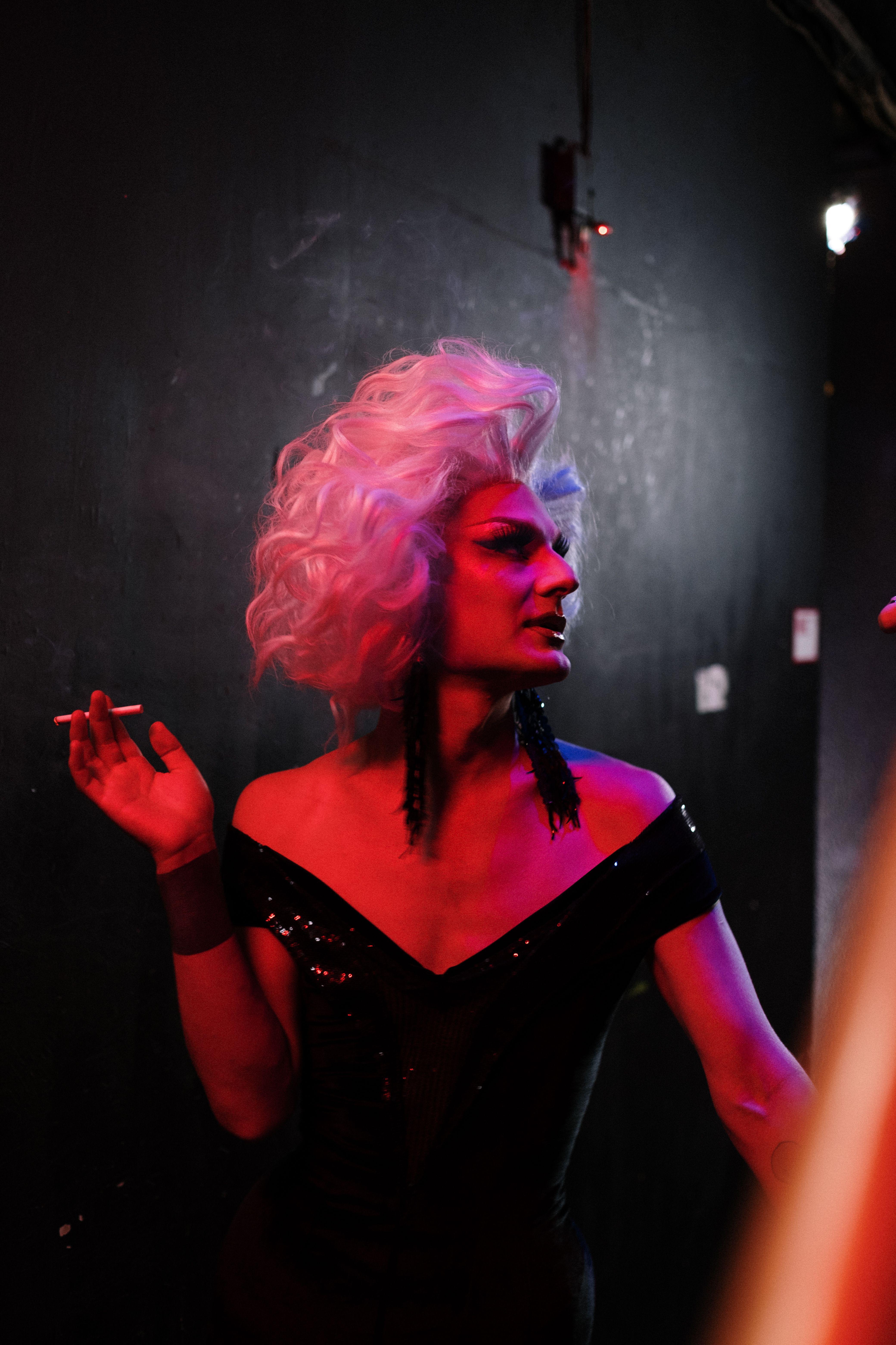 Drag Queen With Hands on Chest · Free Stock Photo