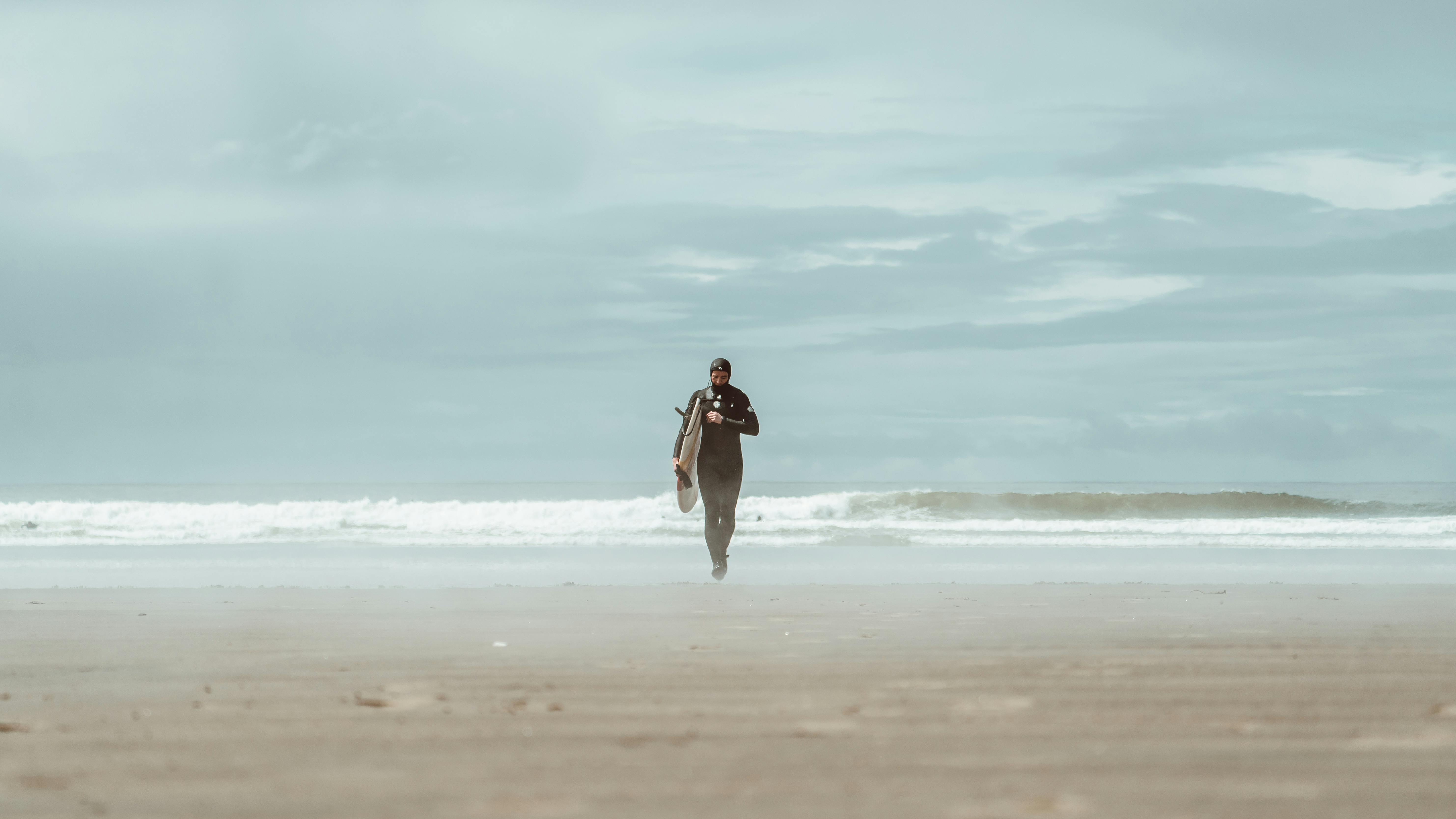 Two Men in Black Wetsuits Surfing on Ocean Waves · Free Stock Photo