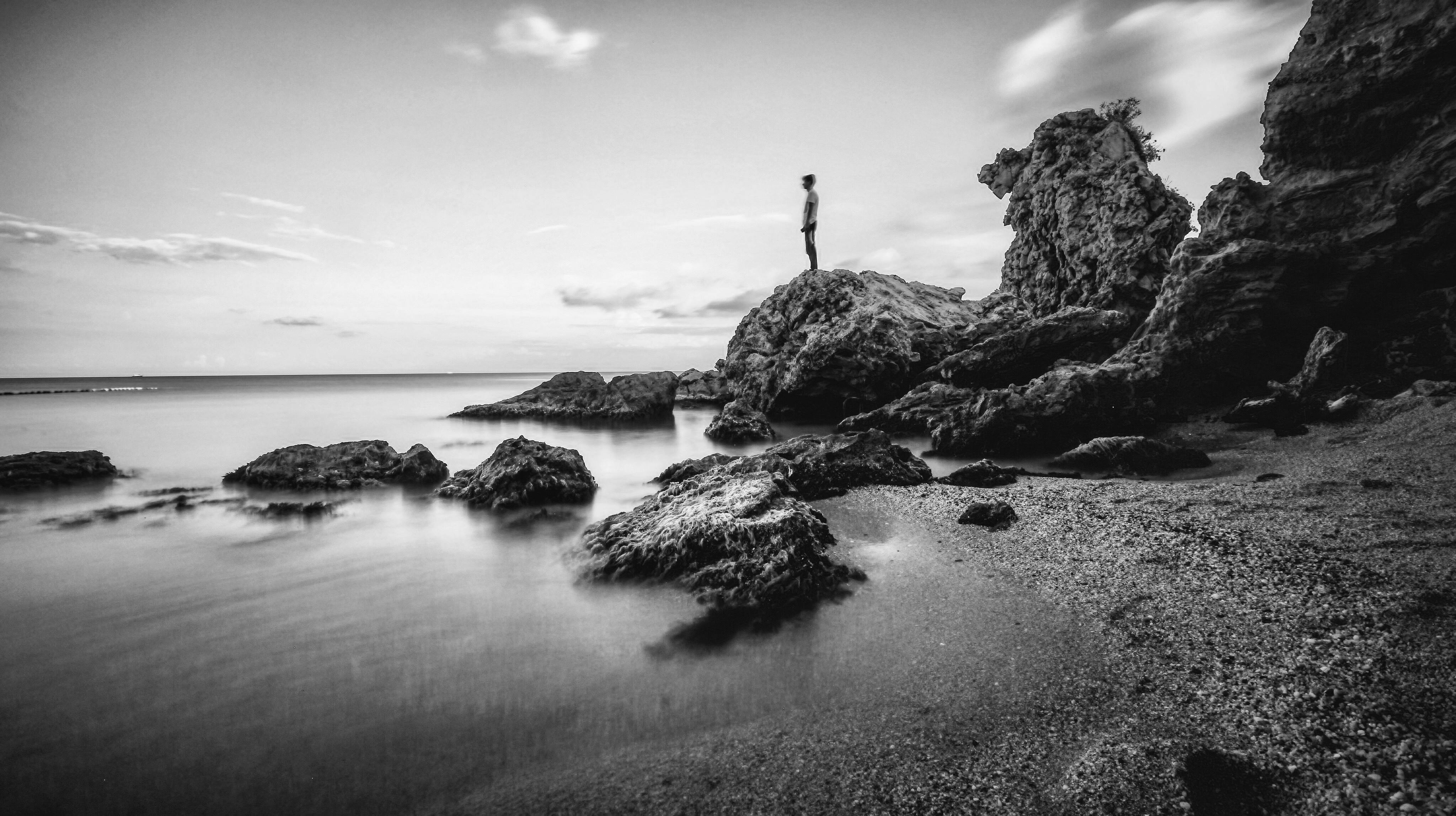 Person Standing on Rock · Free Stock Photo