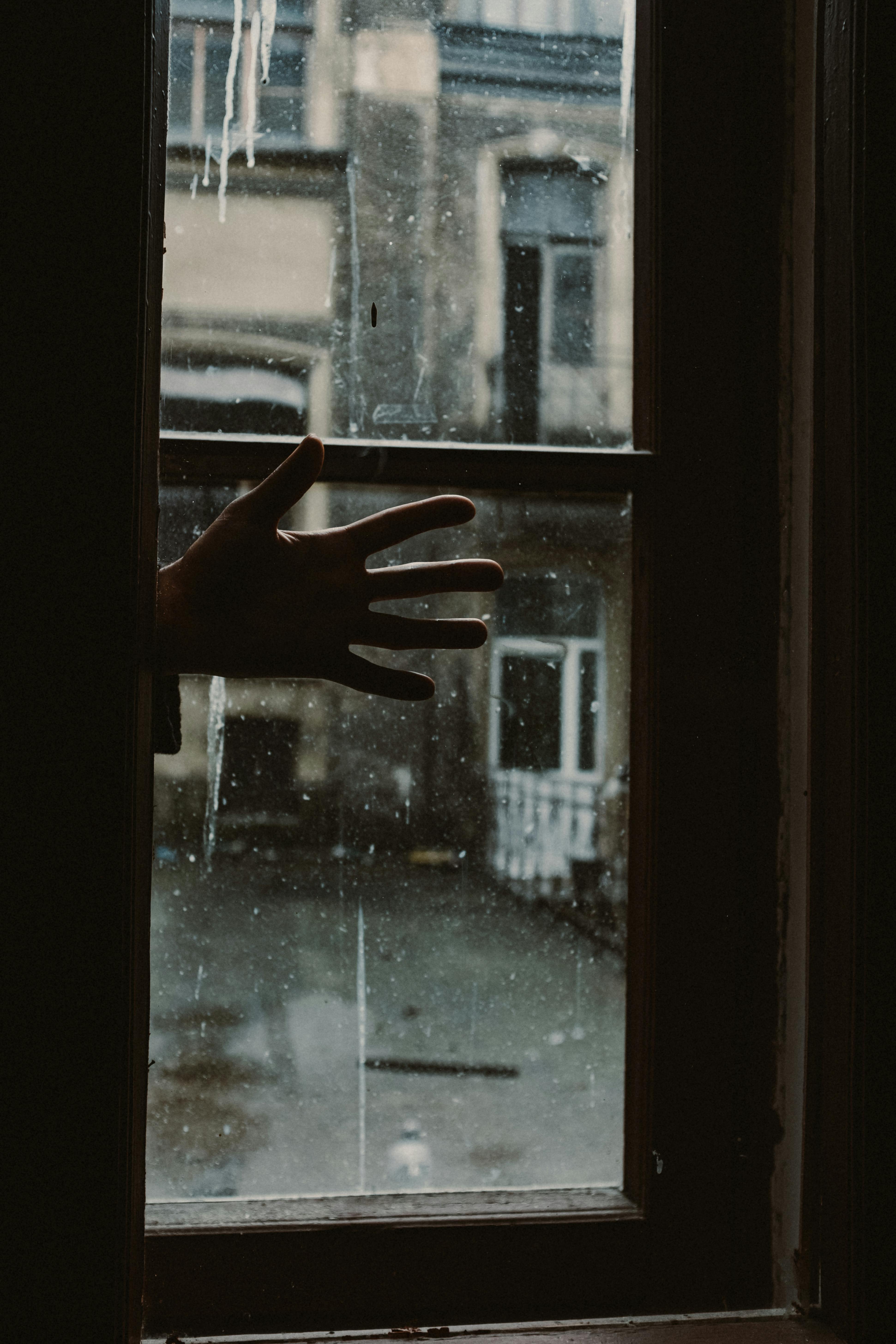 Person Holding Glass Window · Free Stock Photo