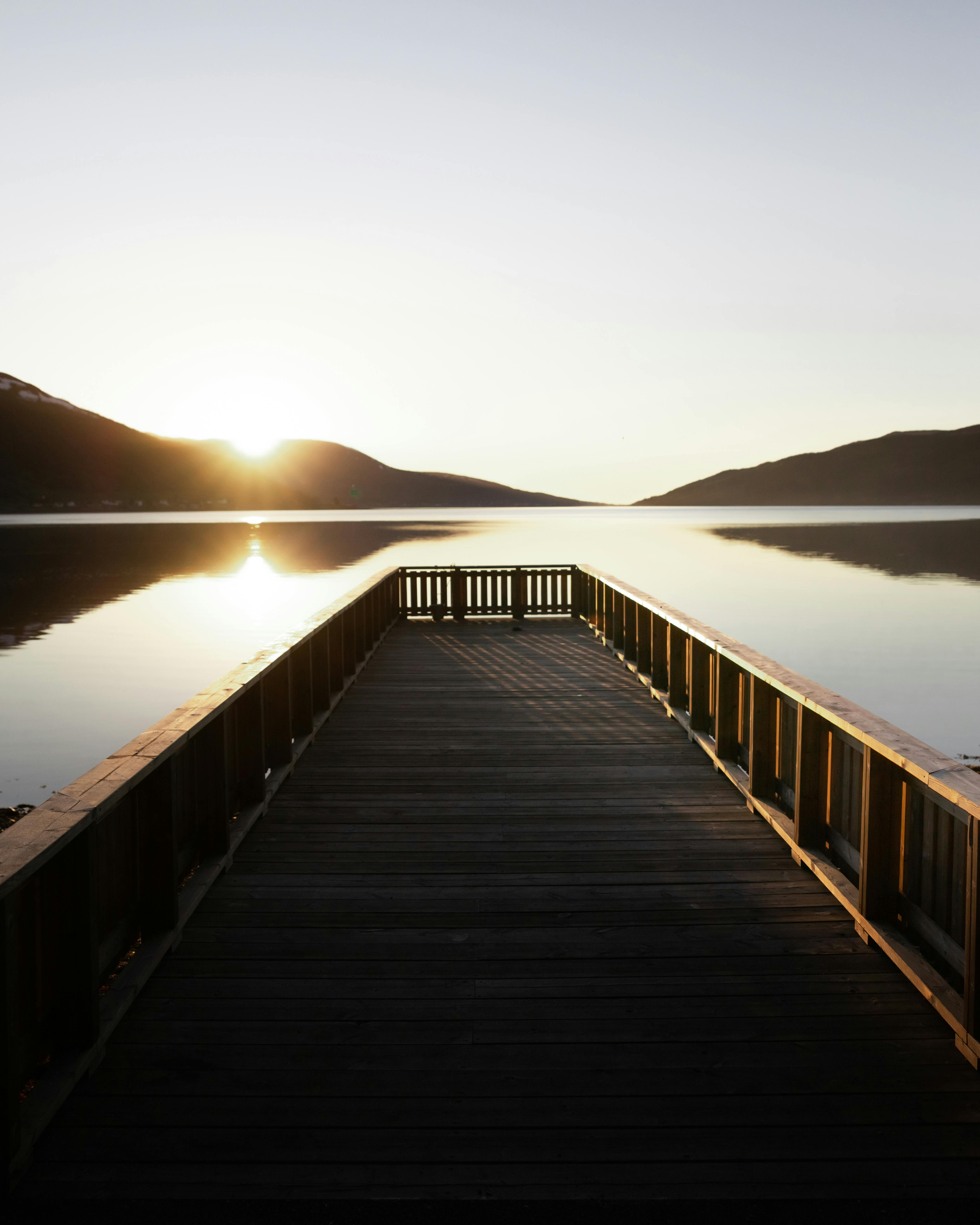 Wooden Boardwalk Overlooking Sunset on Sea · Free Stock Photo