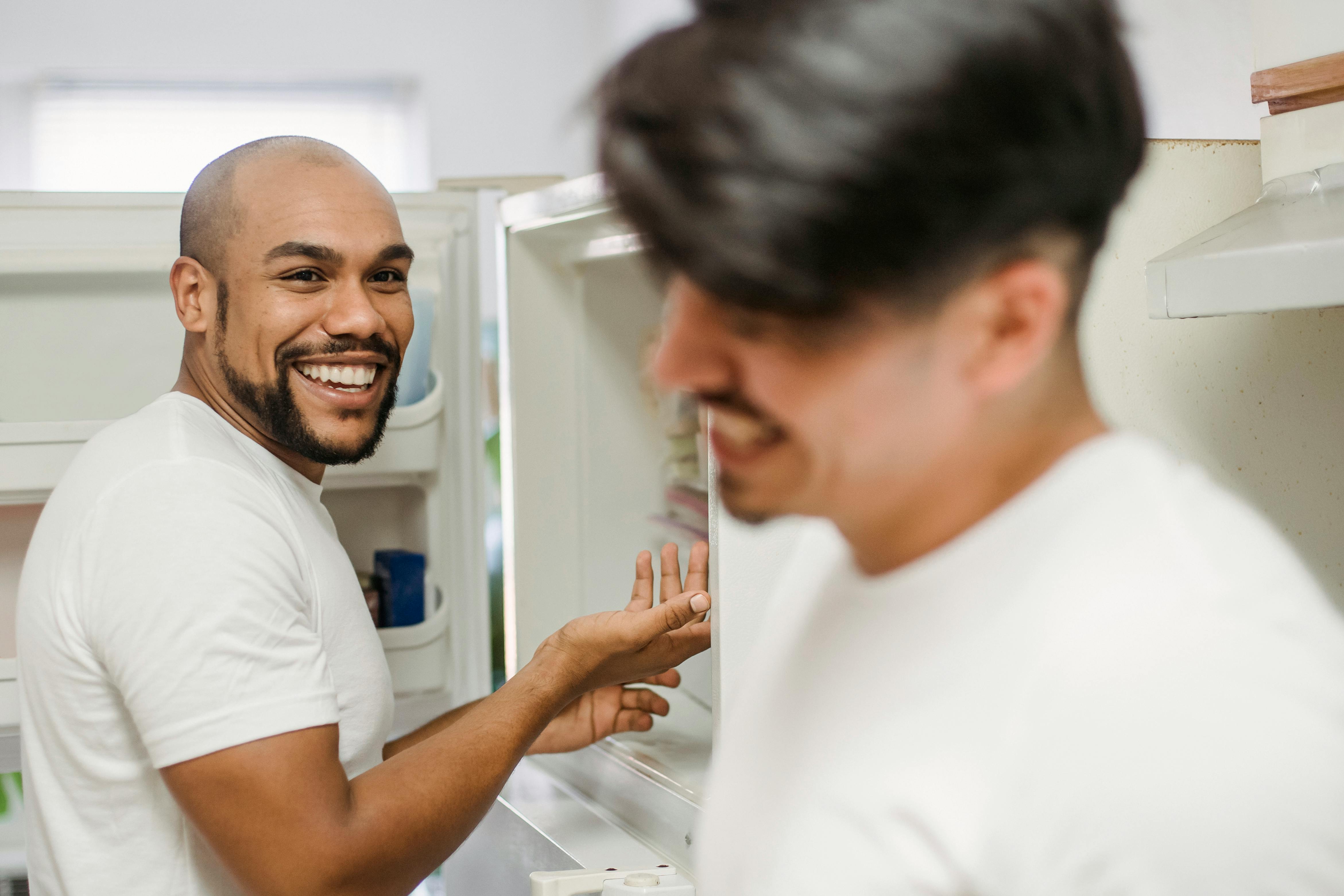 Men Laughing Together in the Kitchen · Free Stock Photo