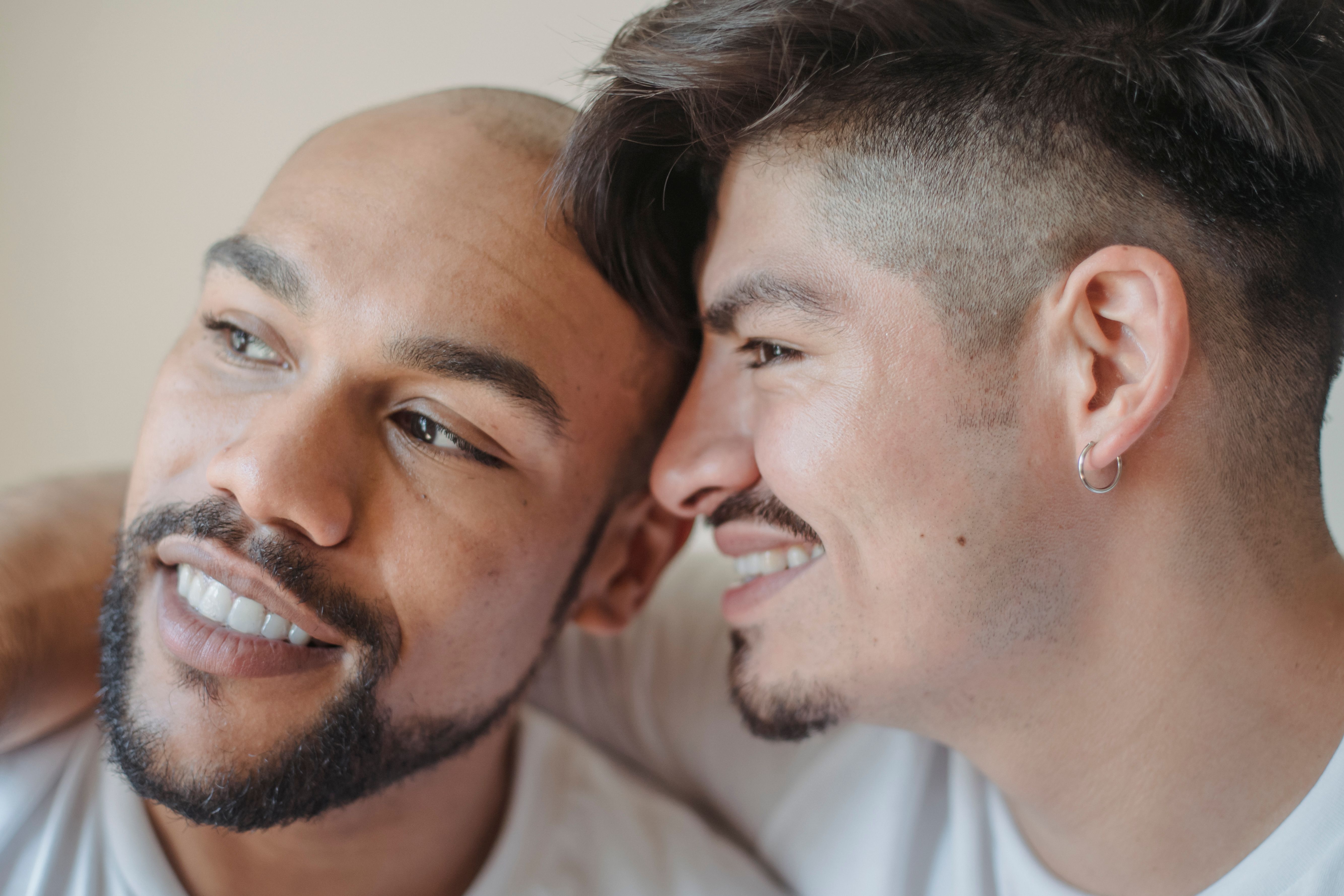 Portrait of Smiling Men Embracing · Free Stock Photo