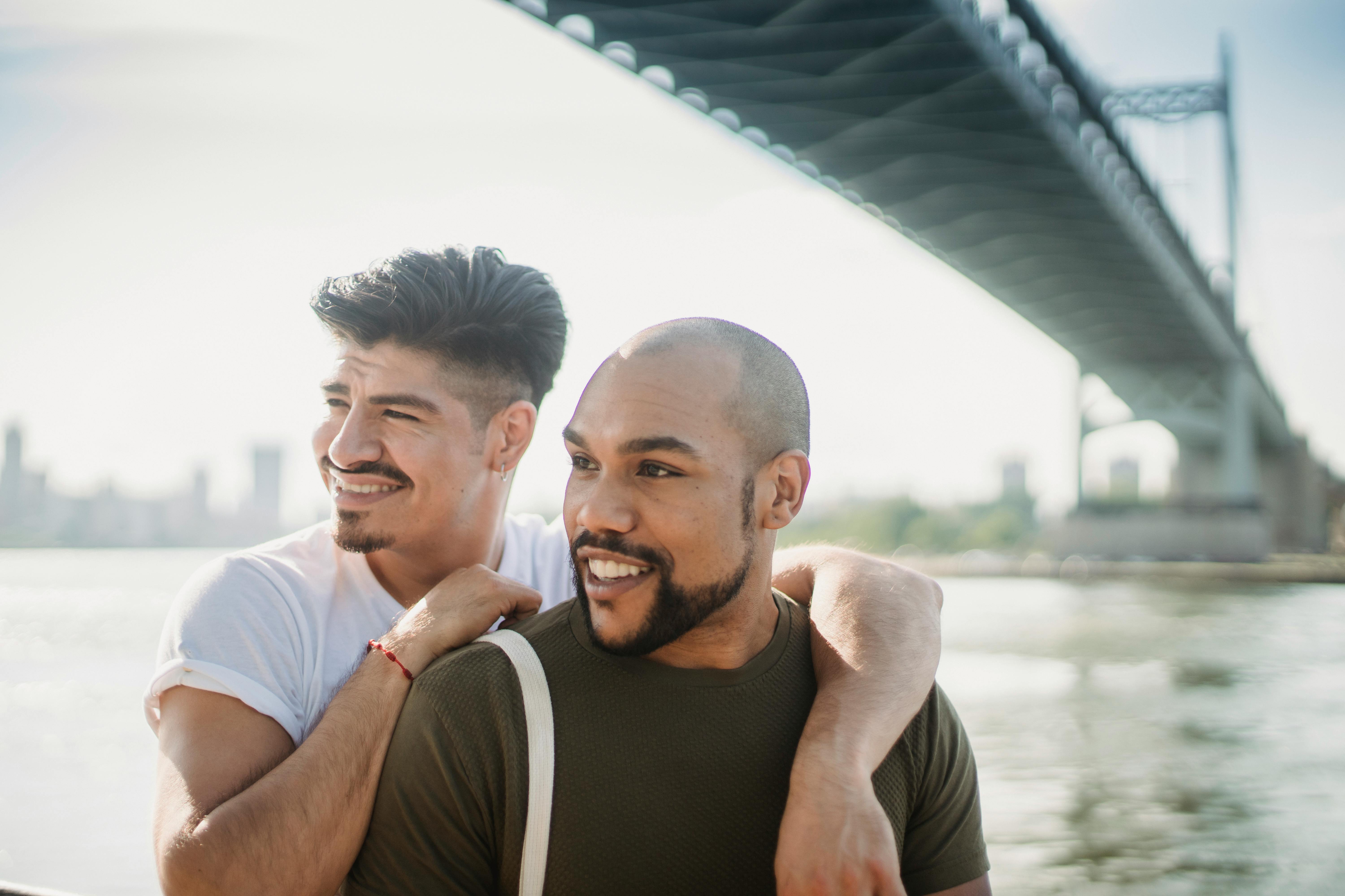 Two Men Standing Under A Bridge · Free Stock Photo