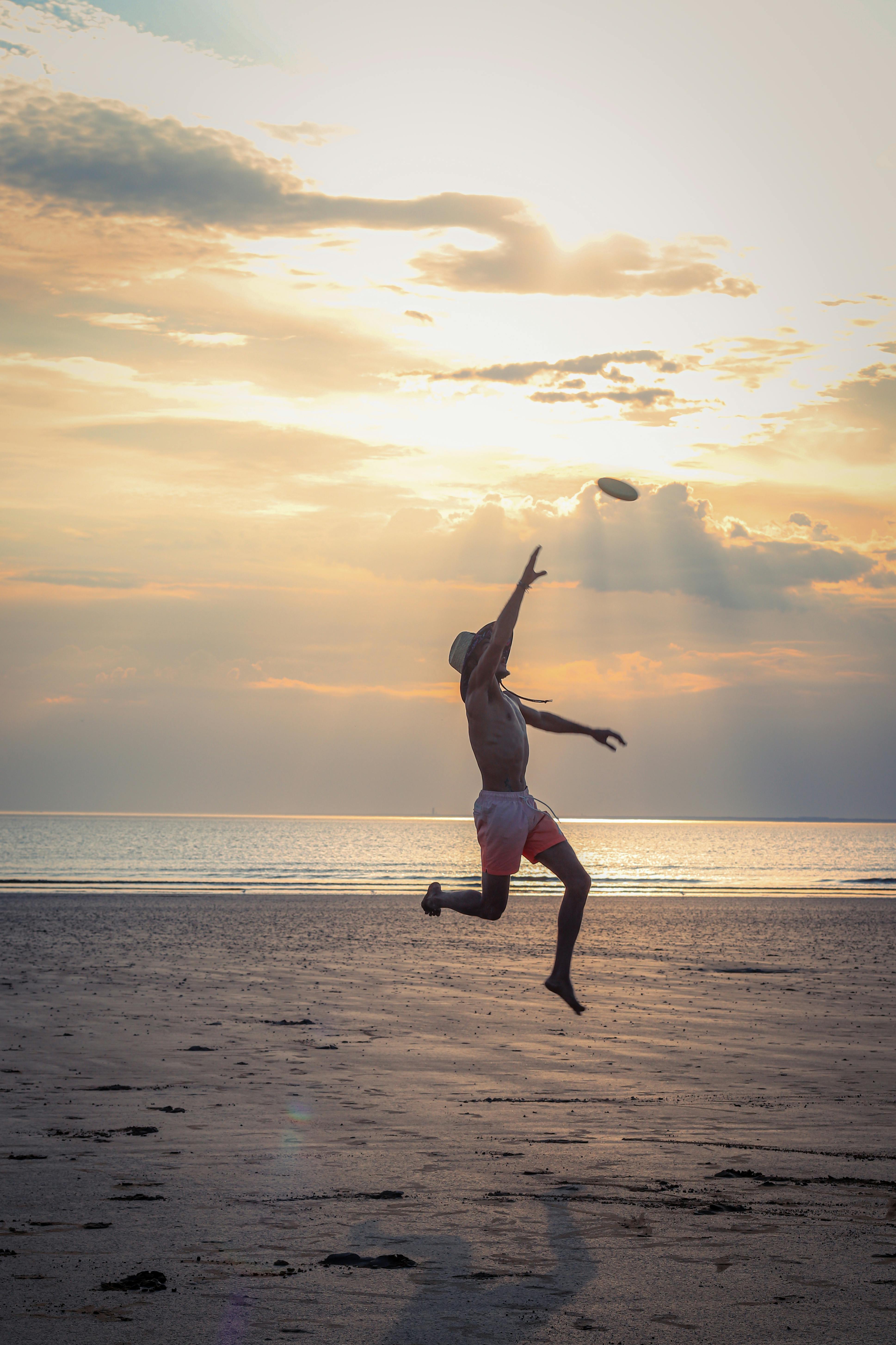 Women Playing Frisbee at the Beach · Free Stock Photo