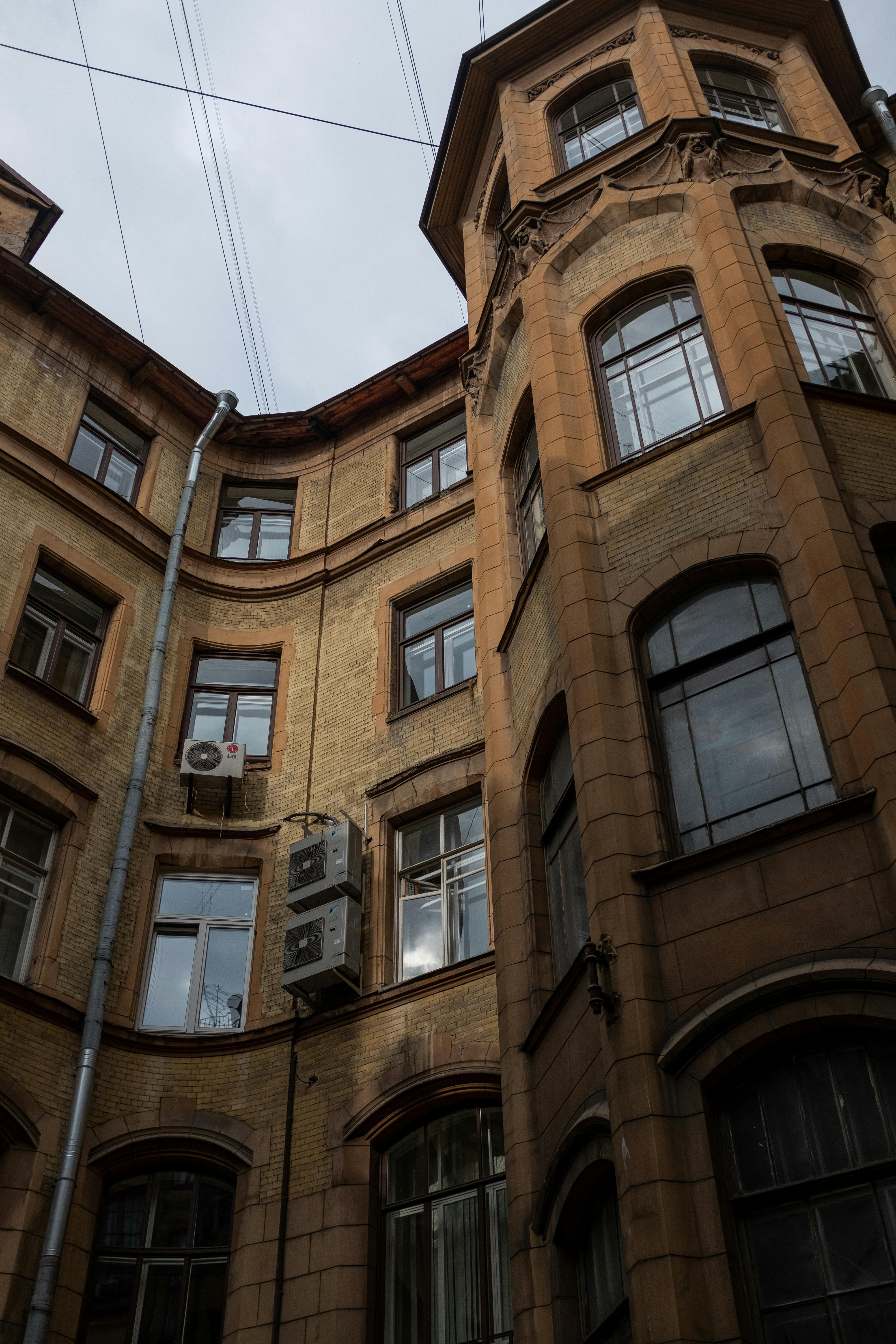 Brown Wooden Window on Brown Brick Building · Free Stock Photo