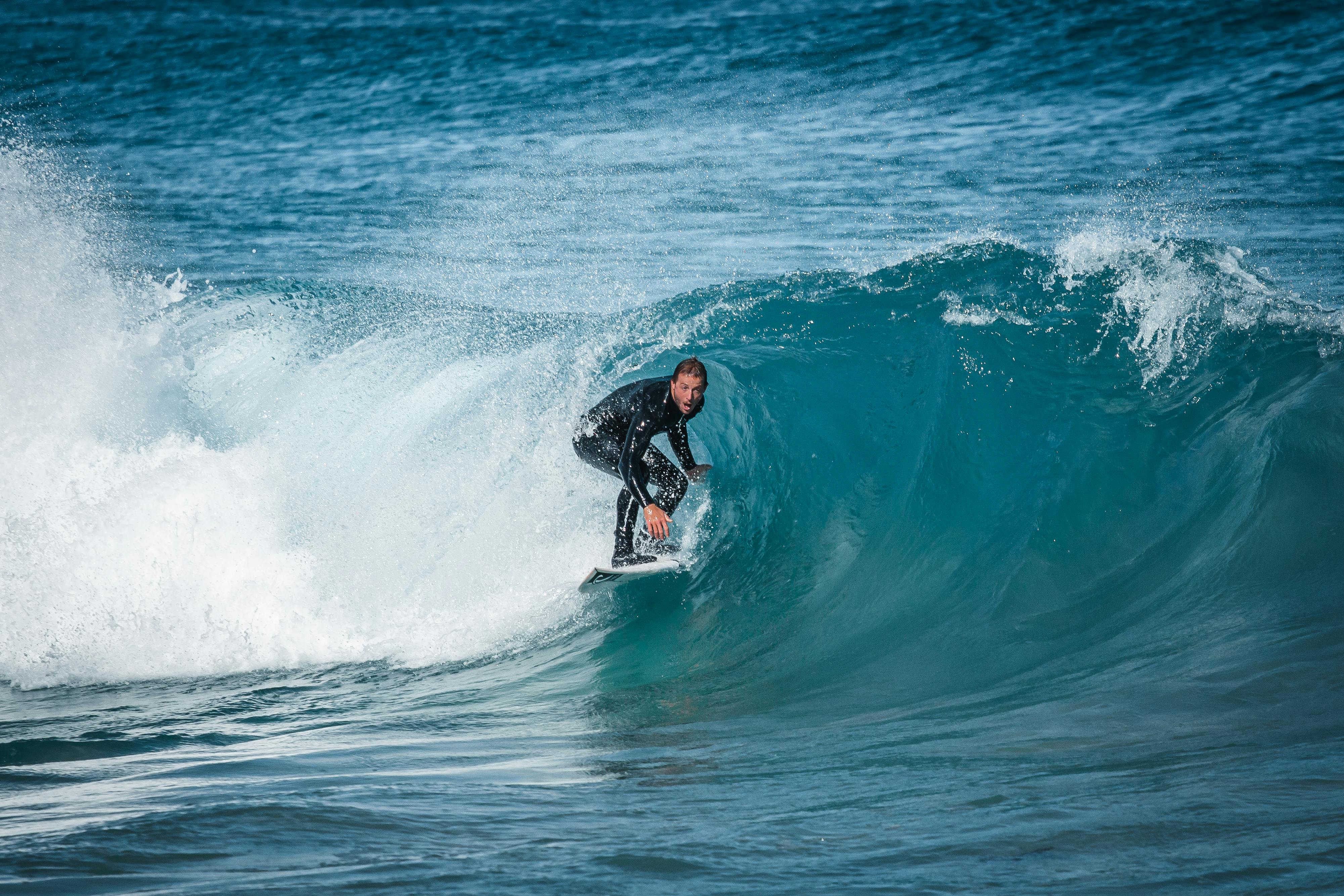 Person in Surfboard in the Wave during Daytime · Free Stock Photo